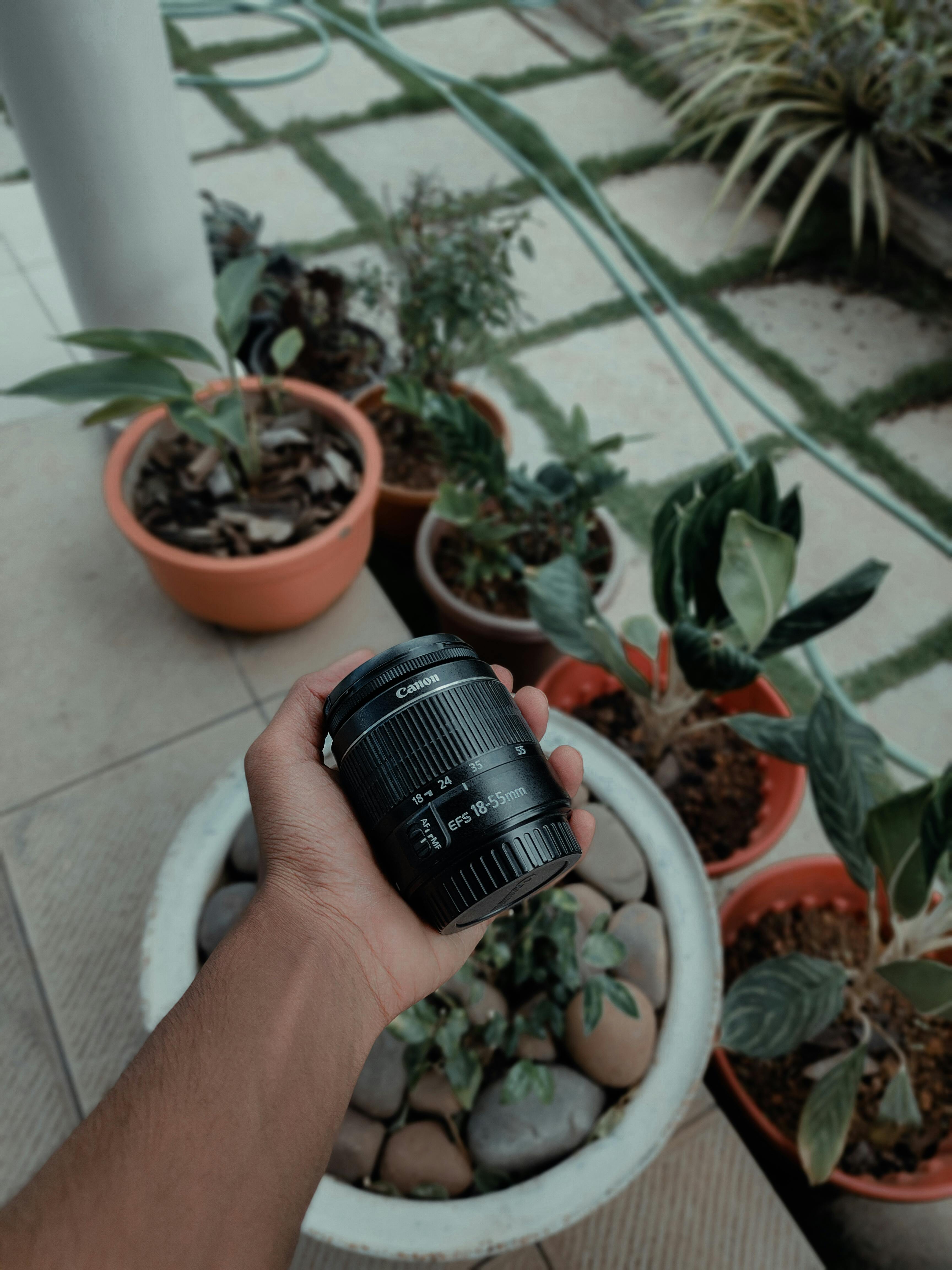 Hand Holding Camera Lens · Free Stock Photo