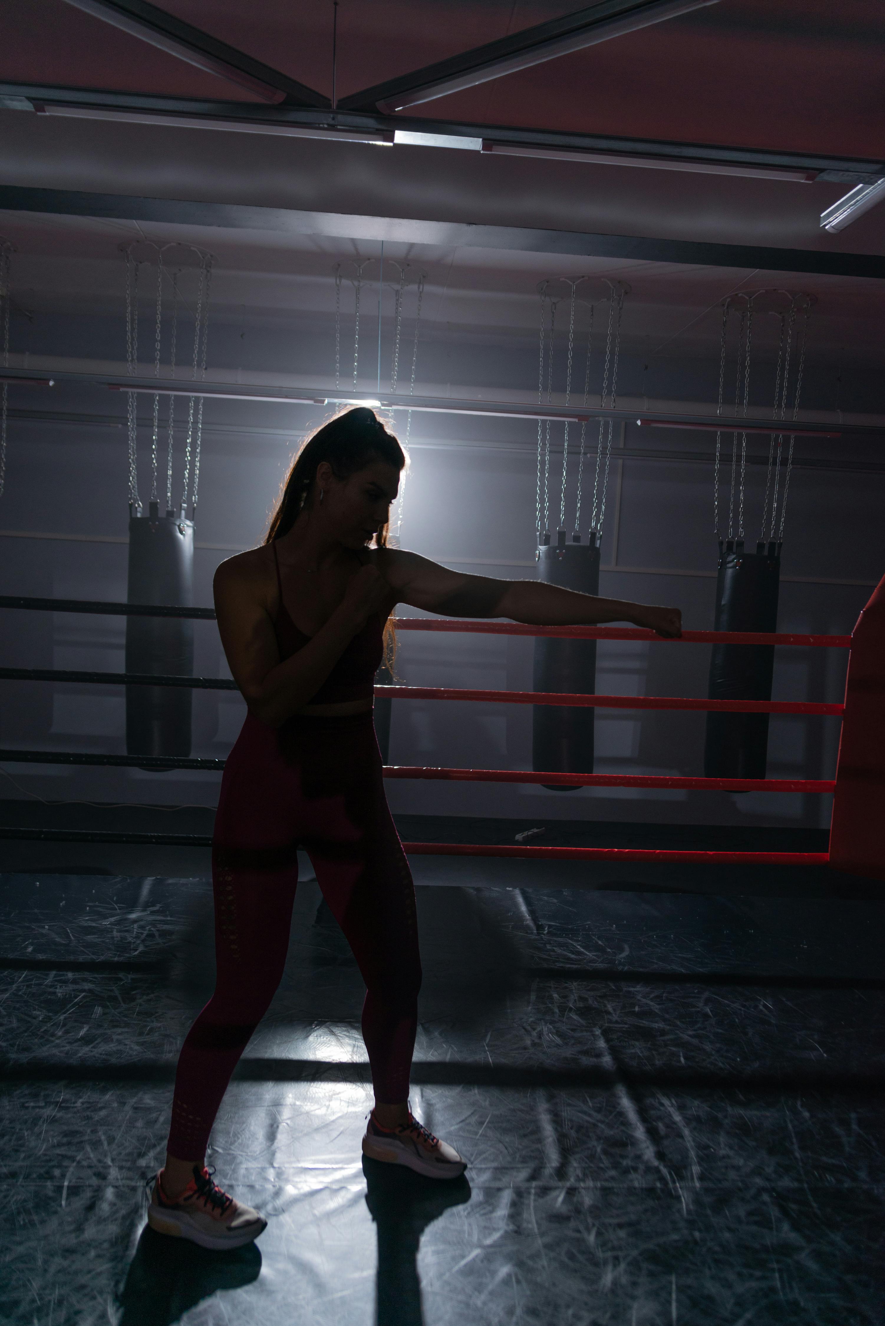 Woman in Pink Activewear Throwing a Punch · Free Stock Photo