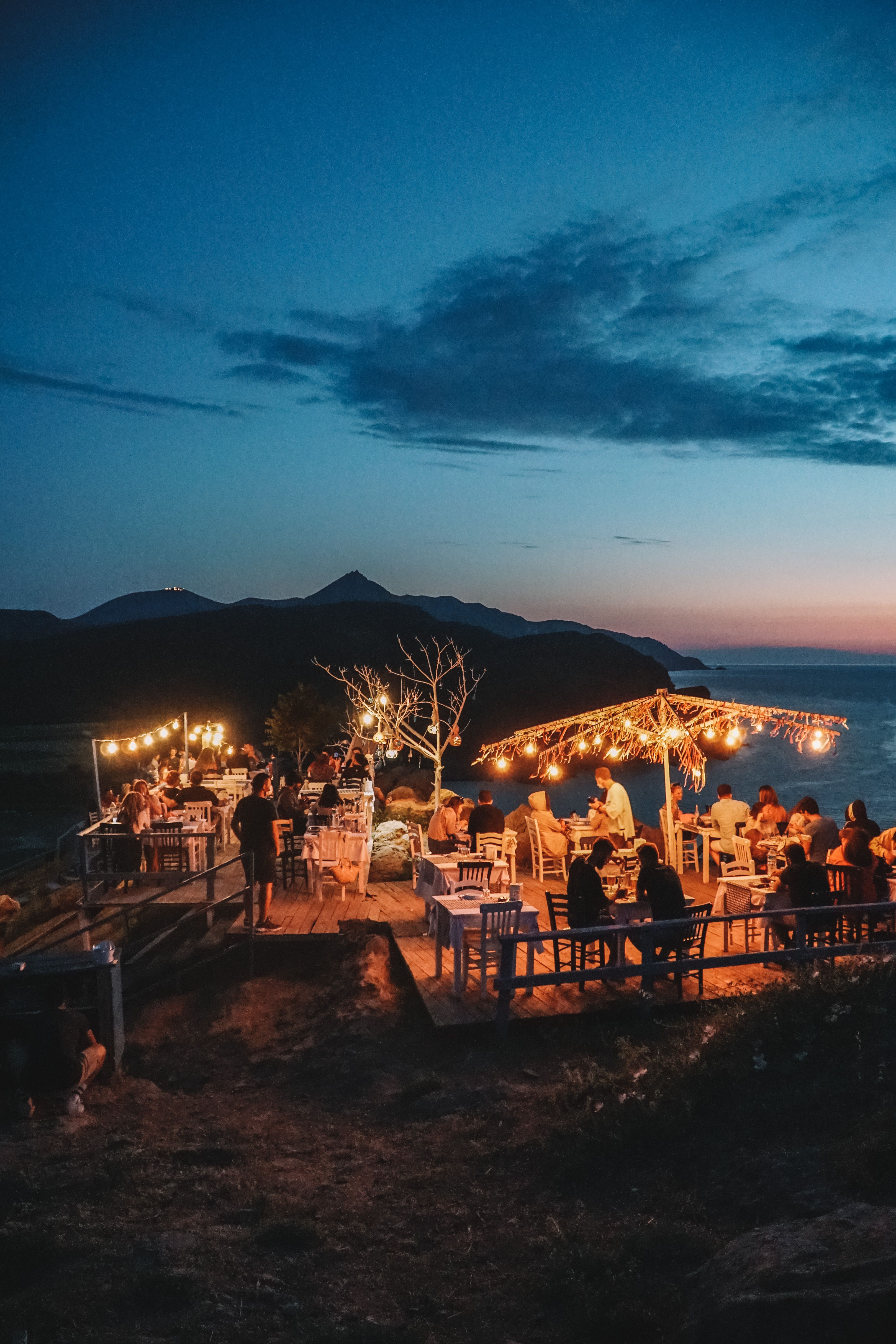 Restaurant Terrace on Seaside Cliff at Dusk · Free Stock Photo