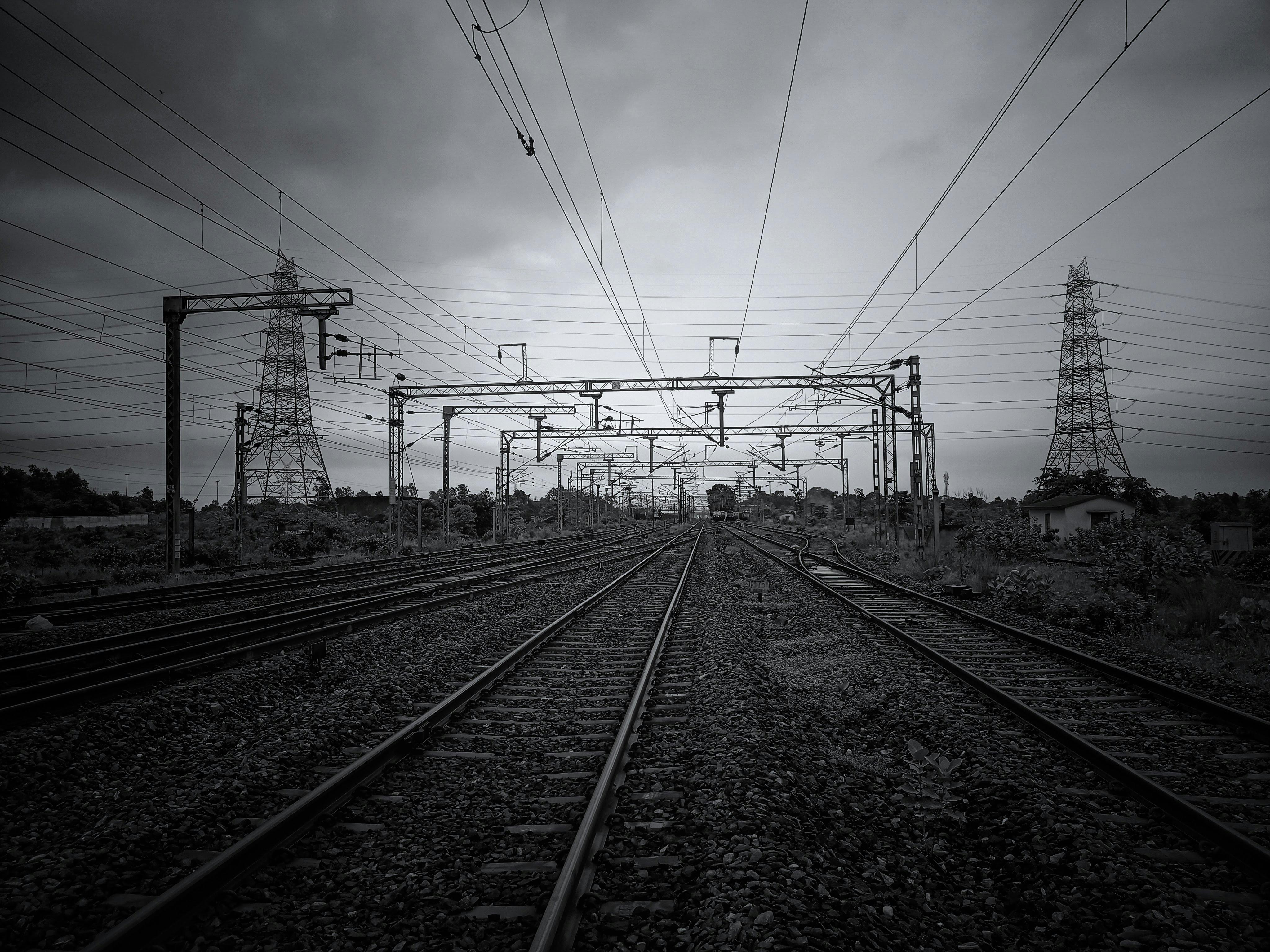 Grayscale Photo of Railway Tracks · Free Stock Photo