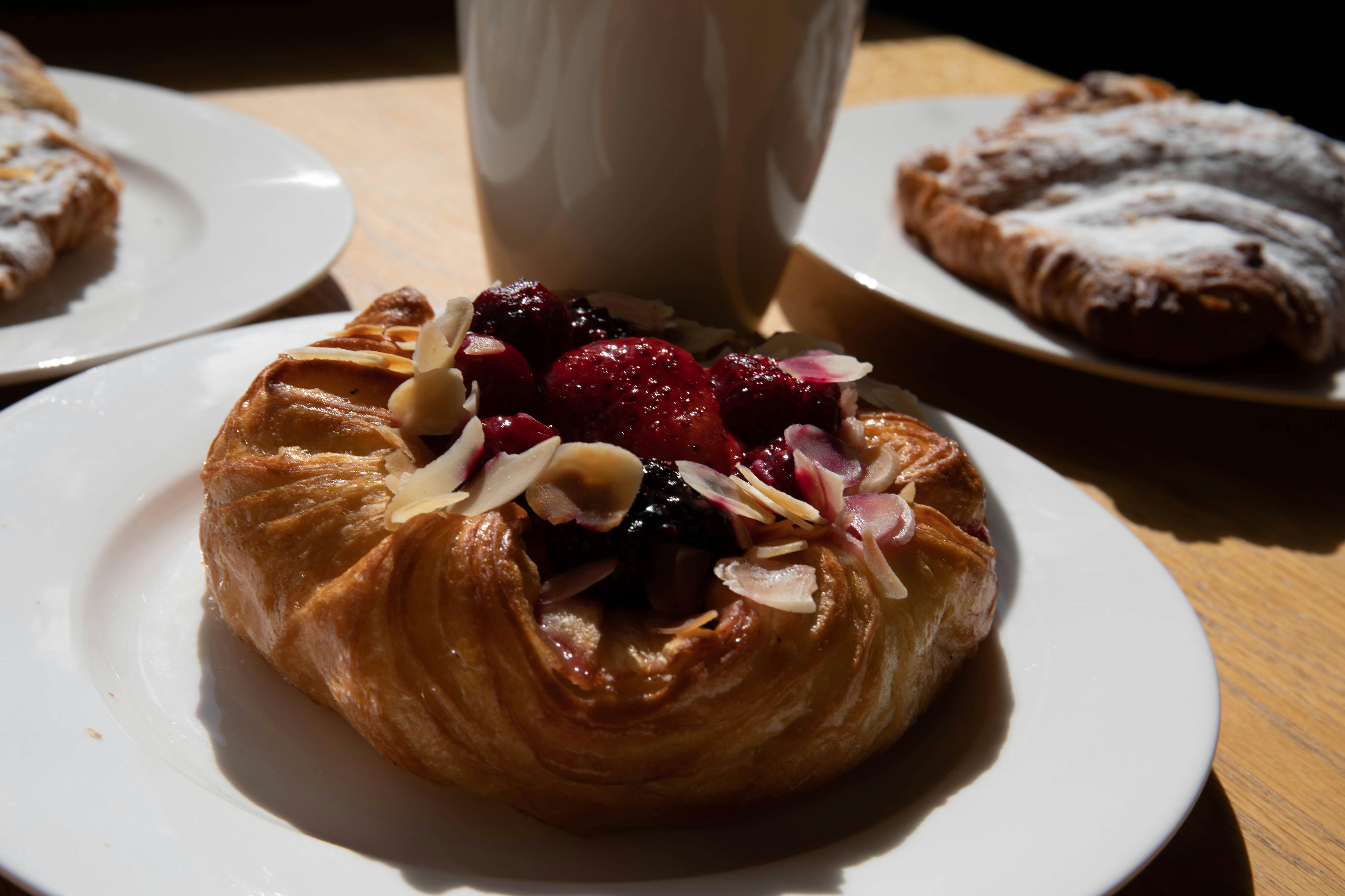 A Child Getting a Tart from a Plate · Free Stock Photo