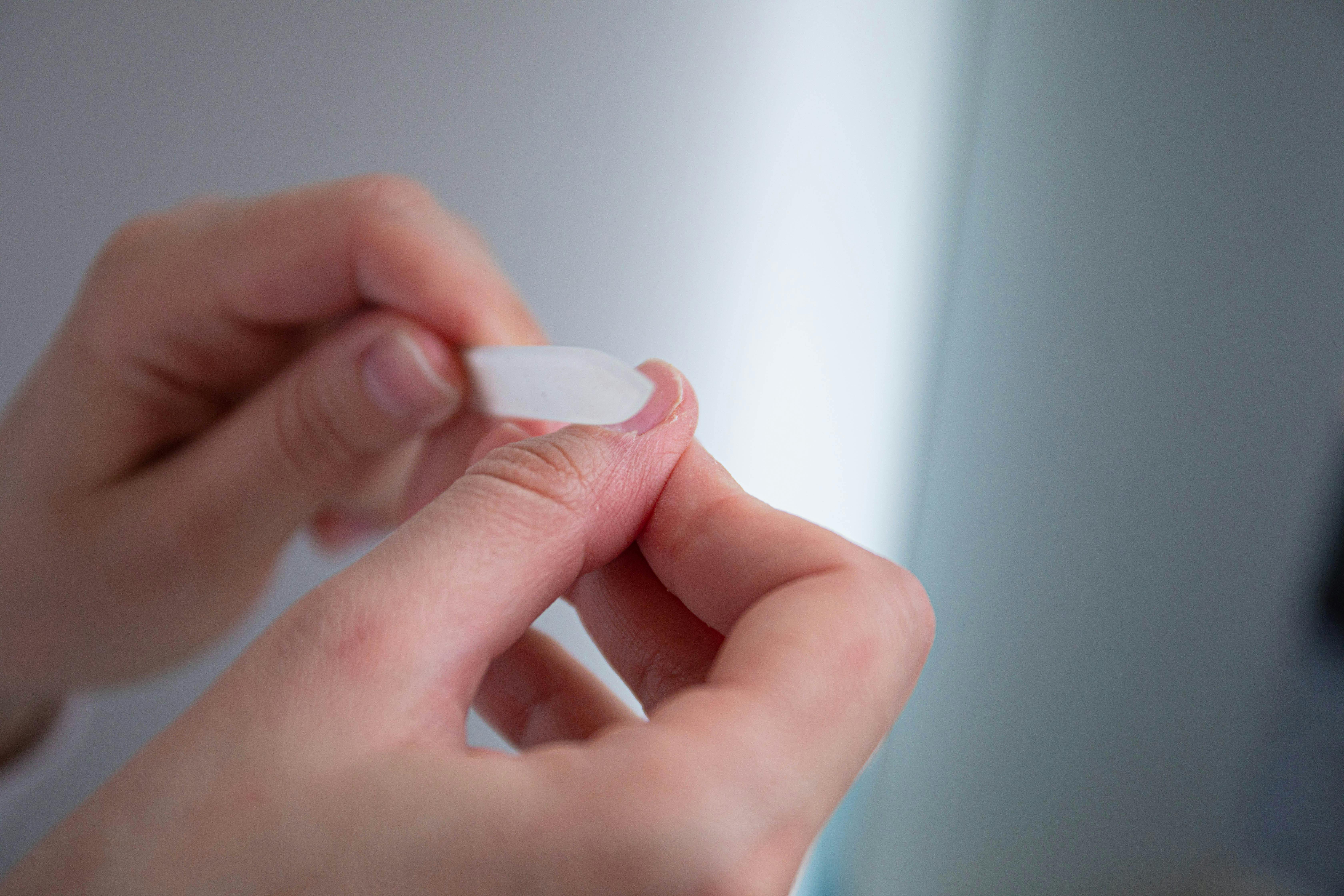 Person Filing Nail · Free Stock Photo