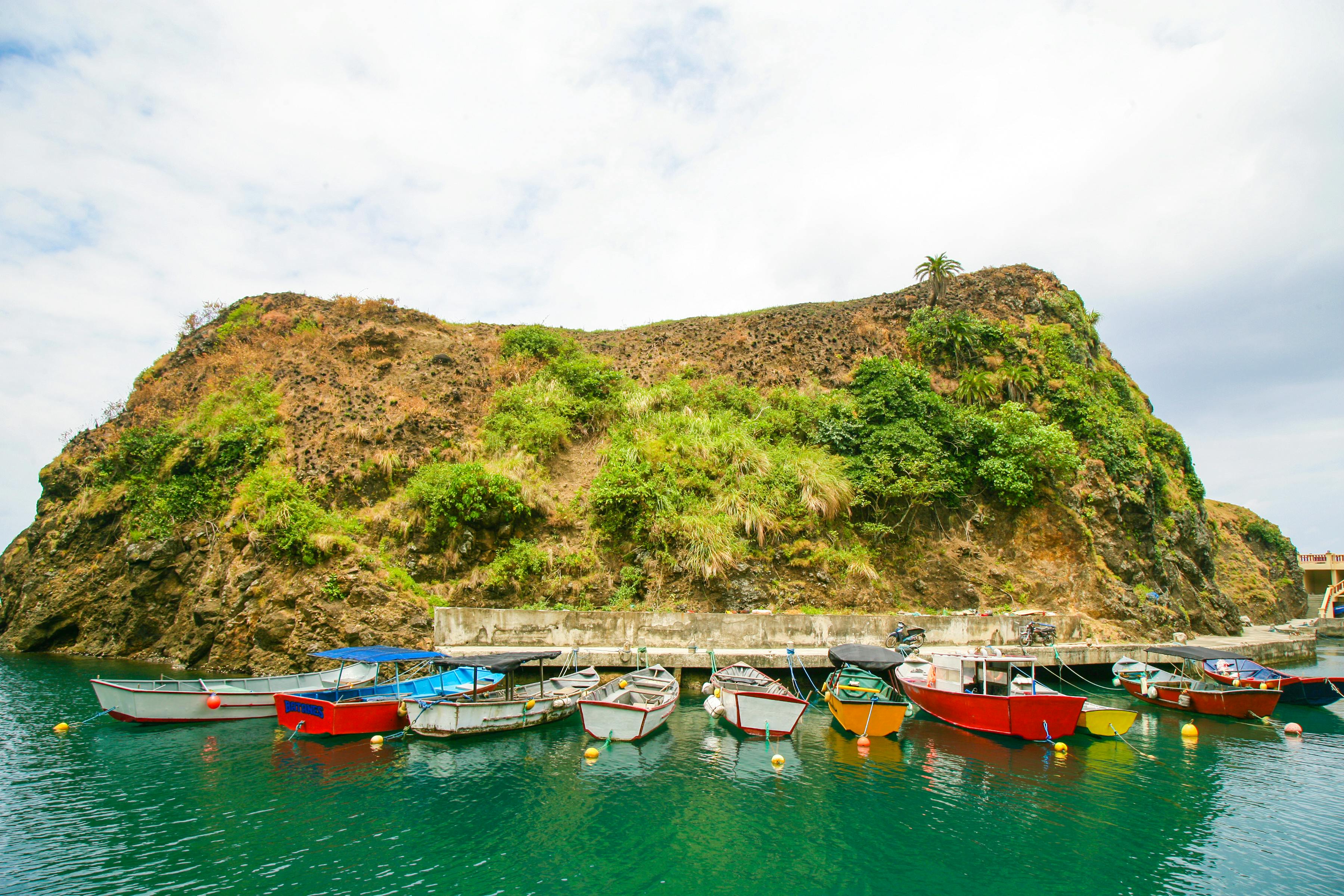 Wooden Boats on Water Near the Rock Formation · Free Stock Photo