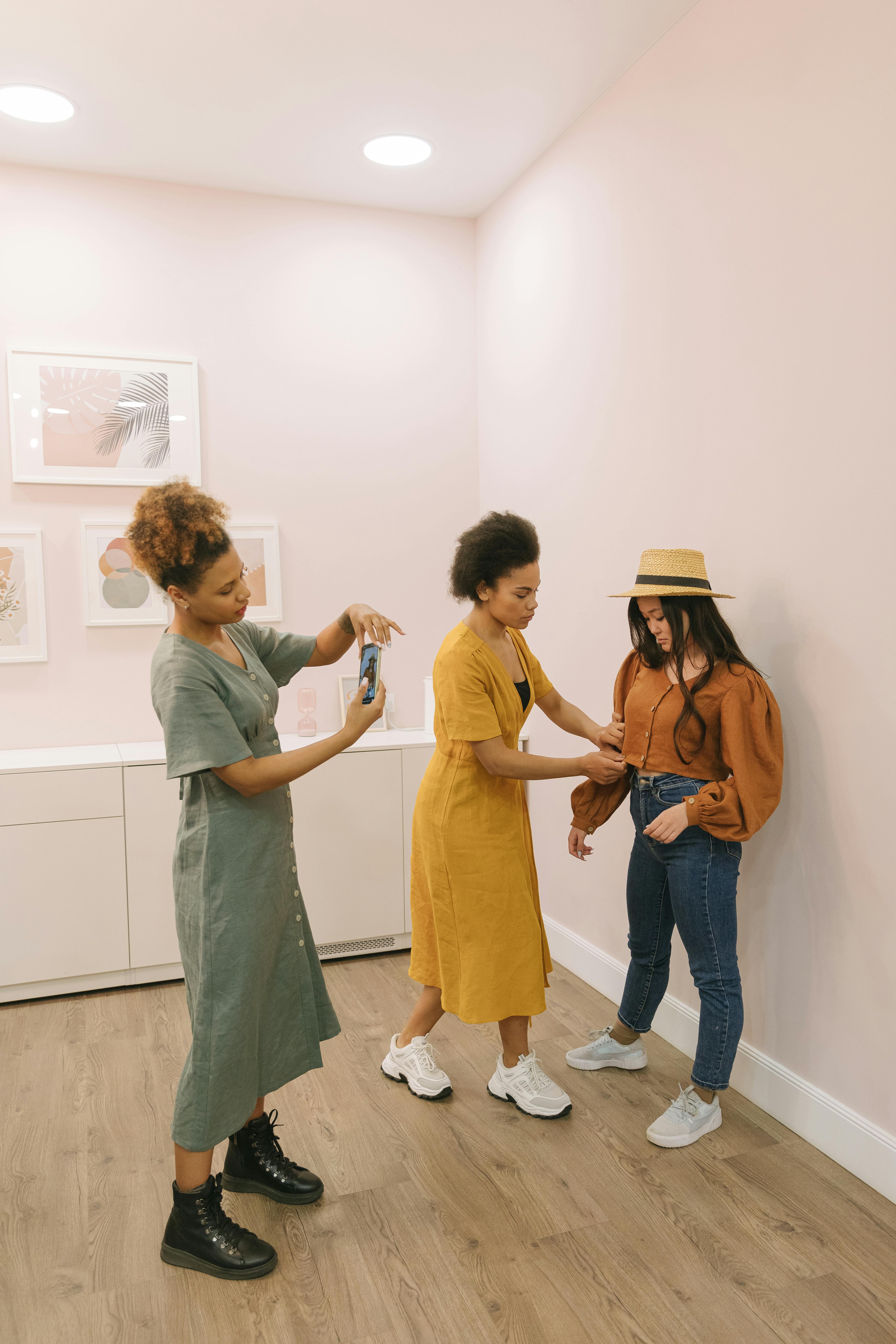 Women Taking Fashion Shots in a Room · Free Stock Photo