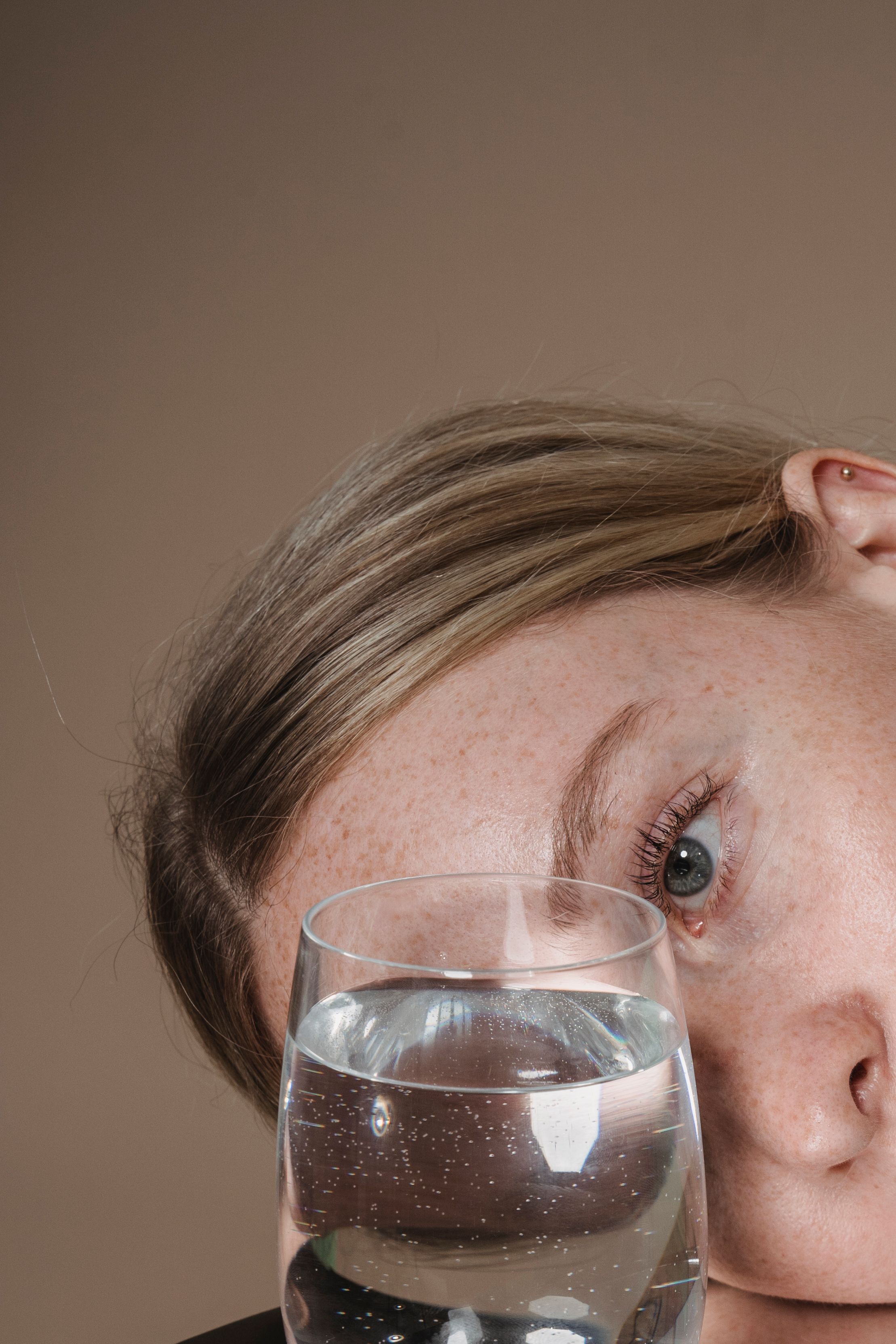Woman Looking at Glass of Water · Free Stock Photo