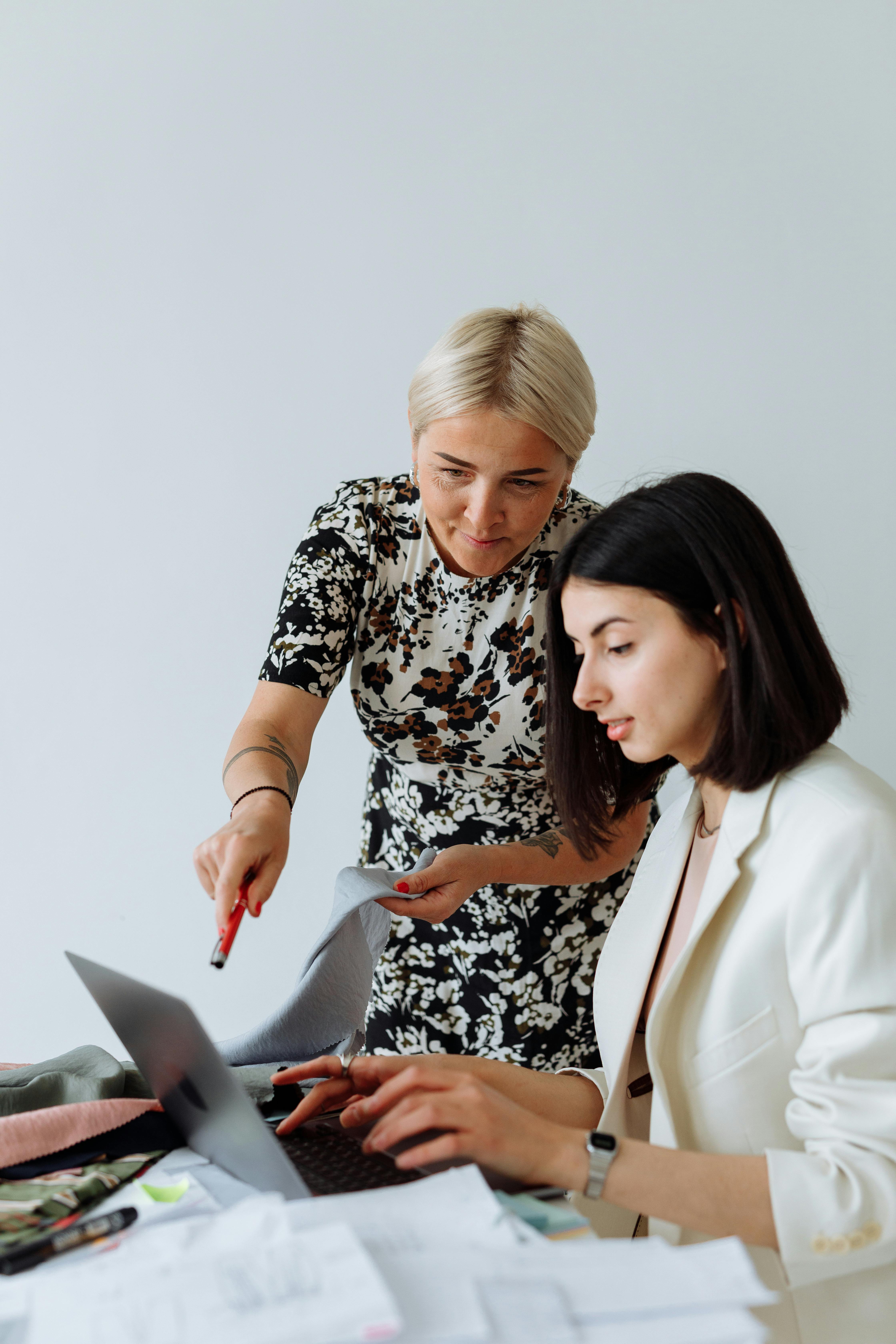 Women Looking at the Screen of a Laptop · Free Stock Photo