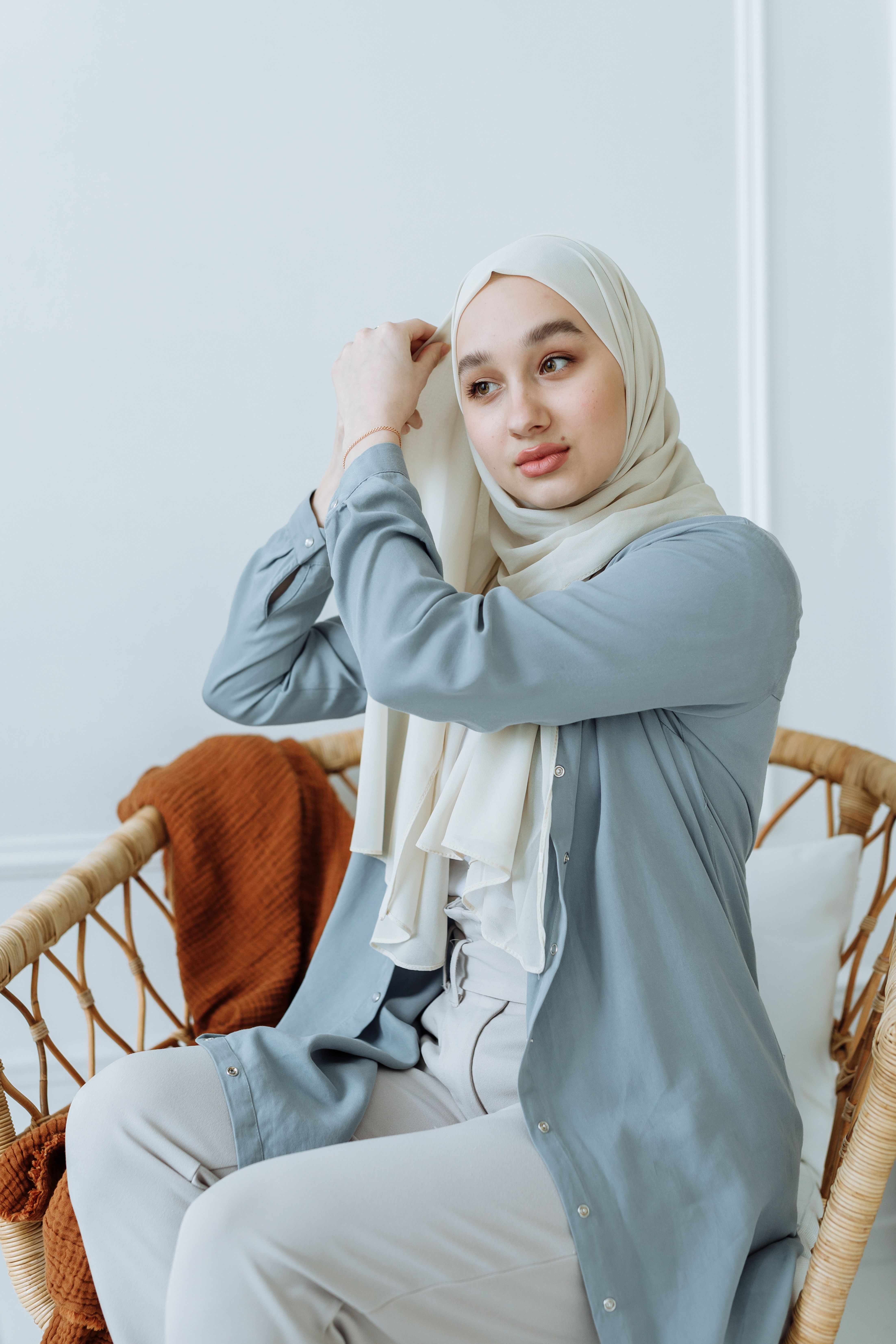 Woman in White Hijab Sitting on the Chair · Free Stock Photo