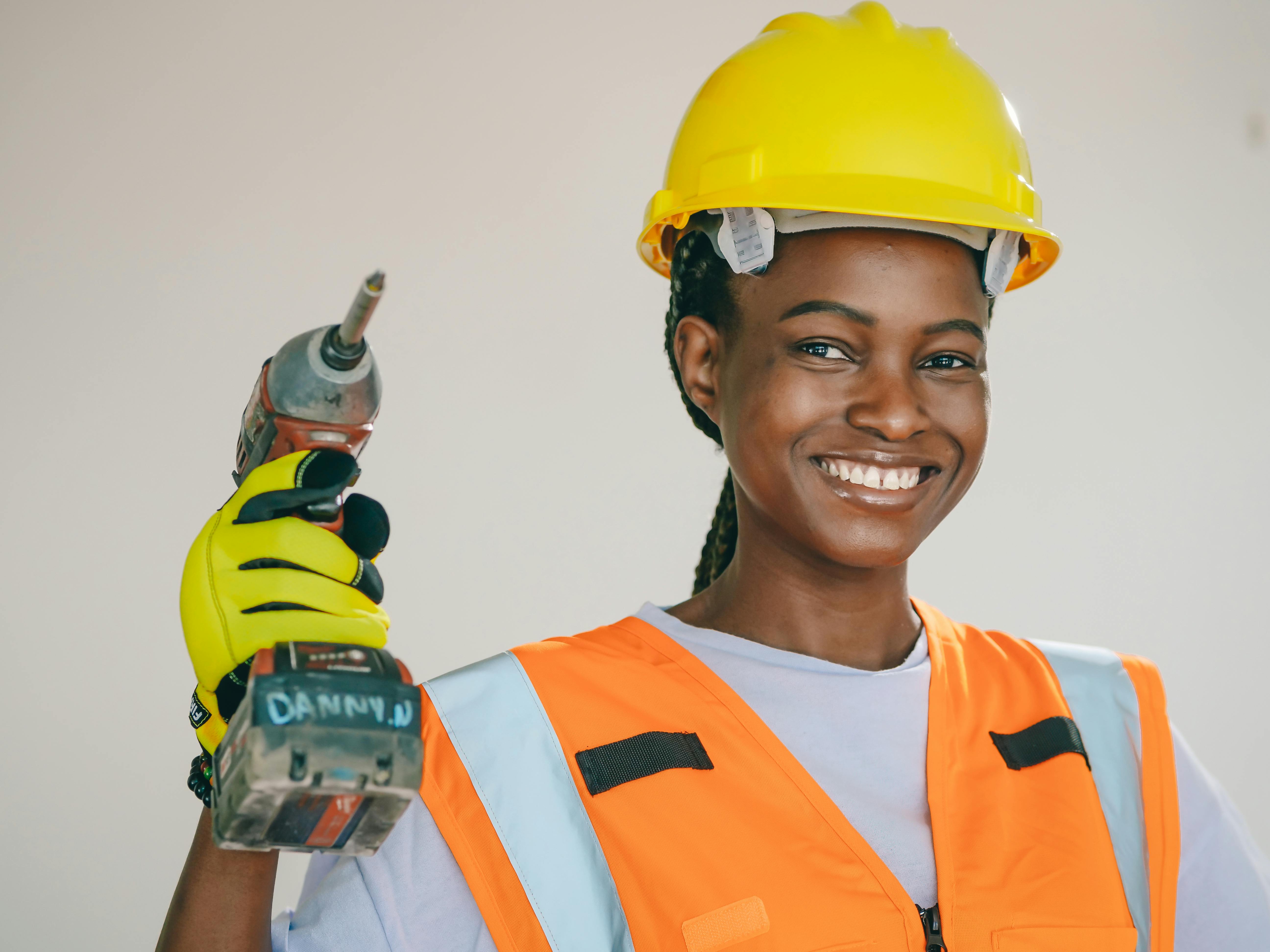 Handywoman Holding a Hammer · Free Stock Photo