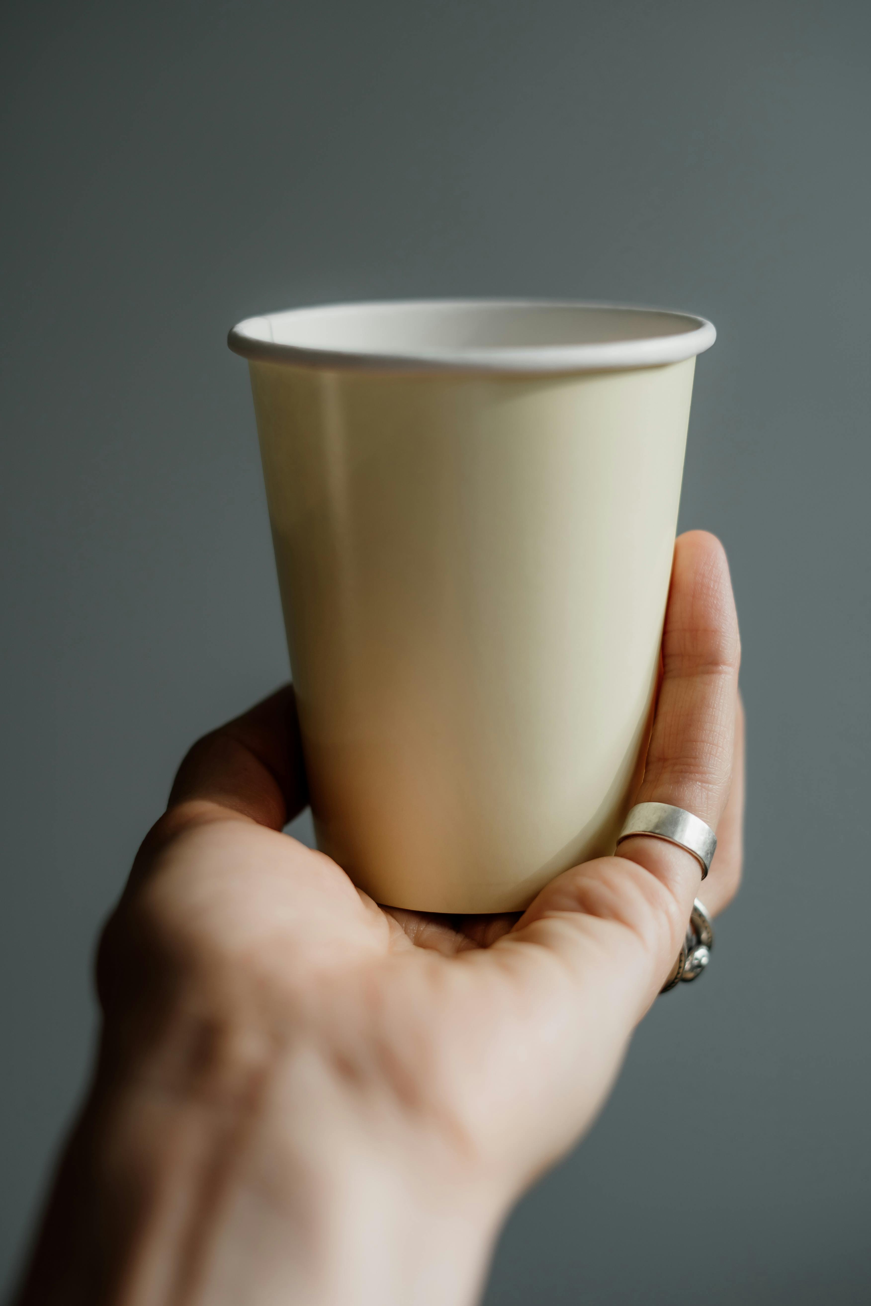 Hand on a Cup of Coffee · Free Stock Photo