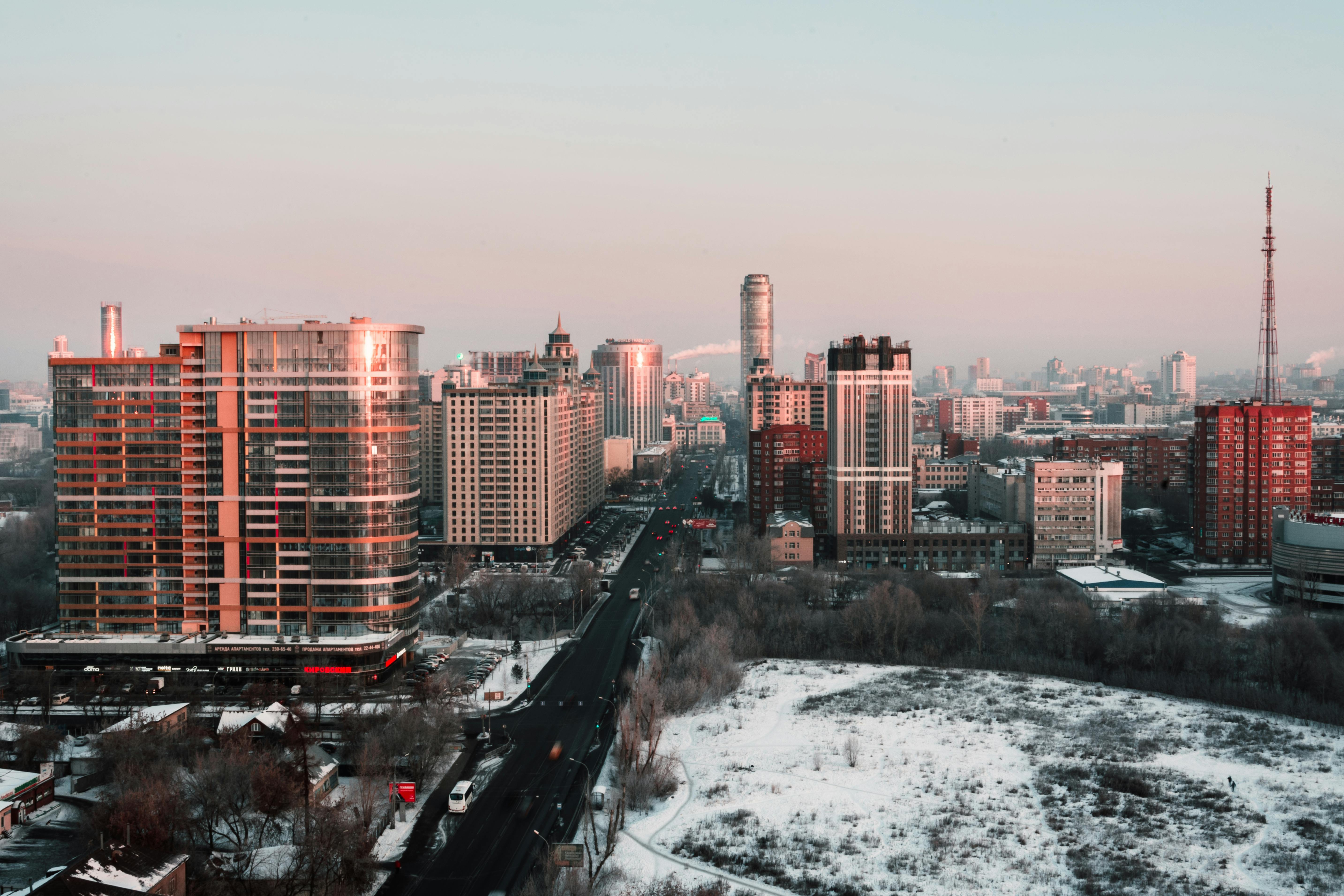 White and Red High-rise Building during Winter Season · Free Stock Photo