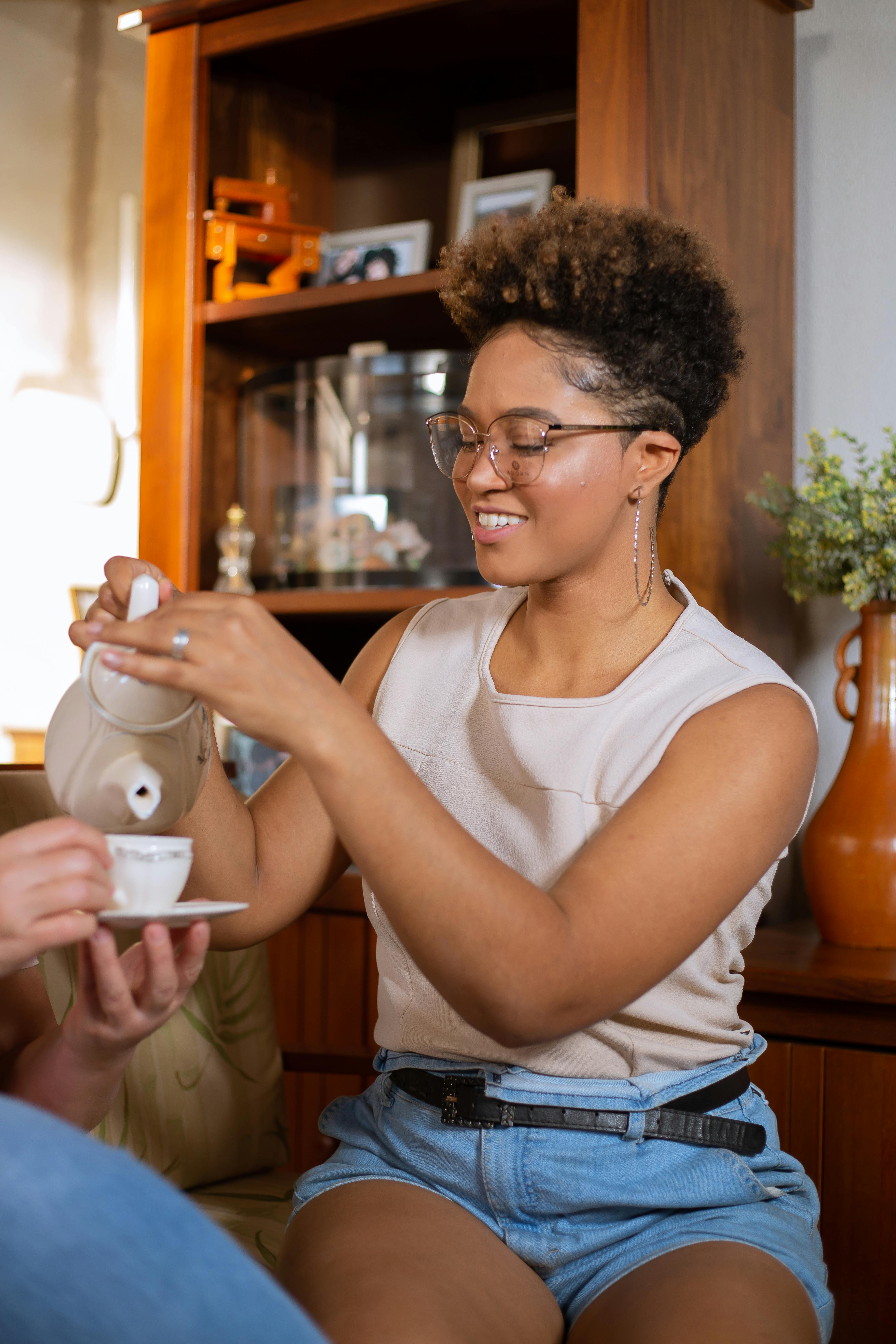 Woman Pouring Tea on Cup · Free Stock Photo