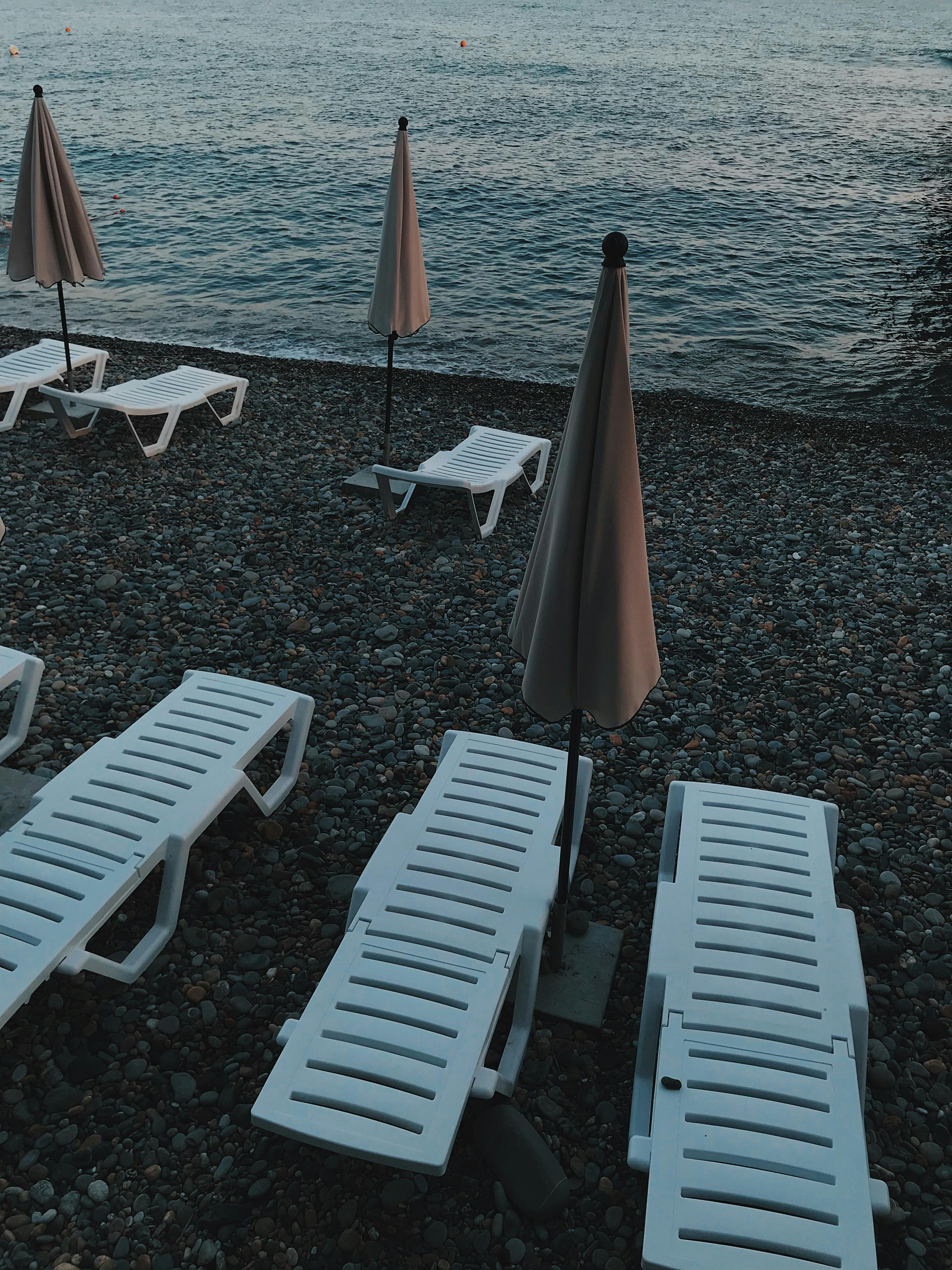 White Plastic Sunbeds on Beach · Free Stock Photo