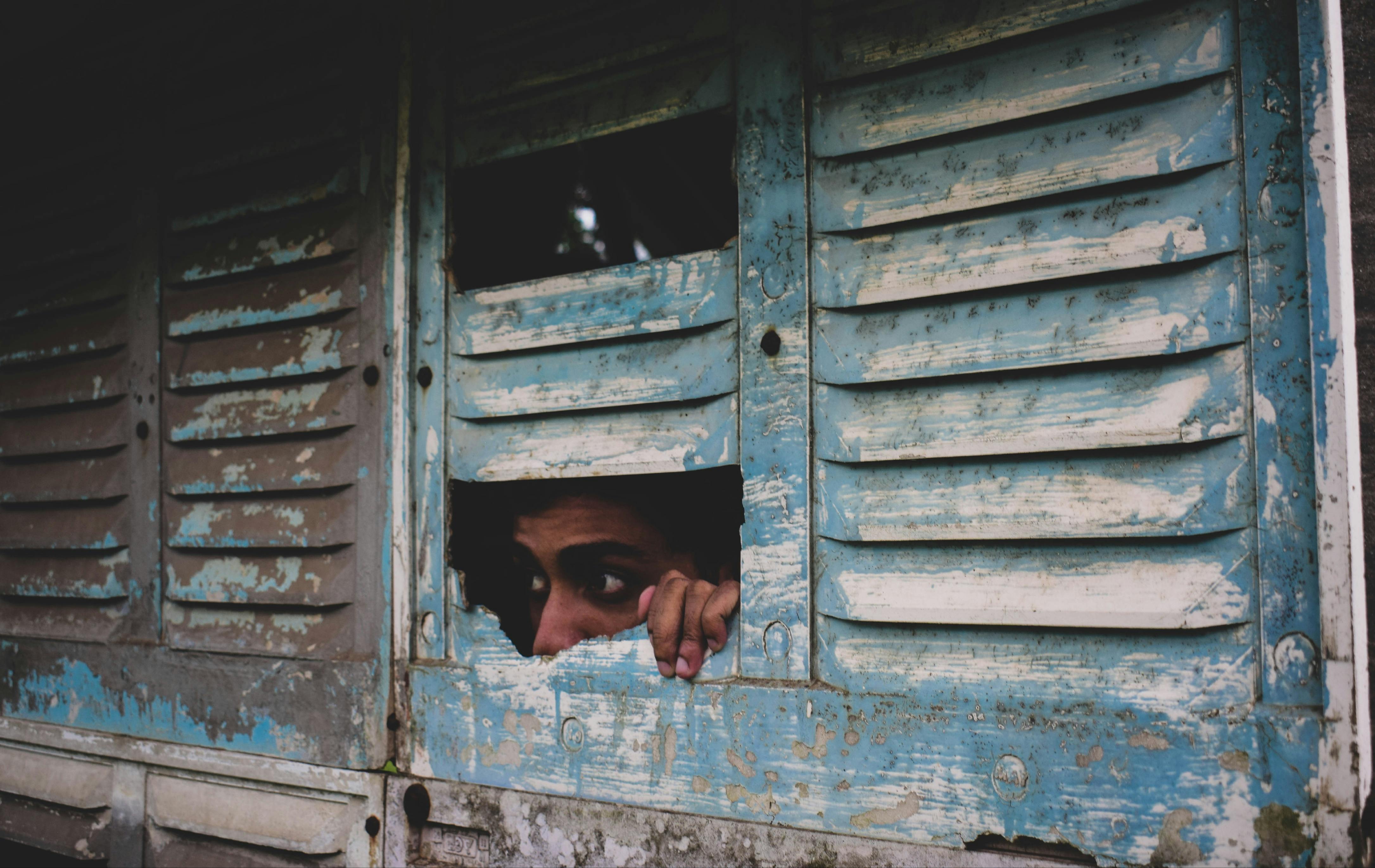 Person Peering Through A Window Photos, Download The BEST Free Person ...