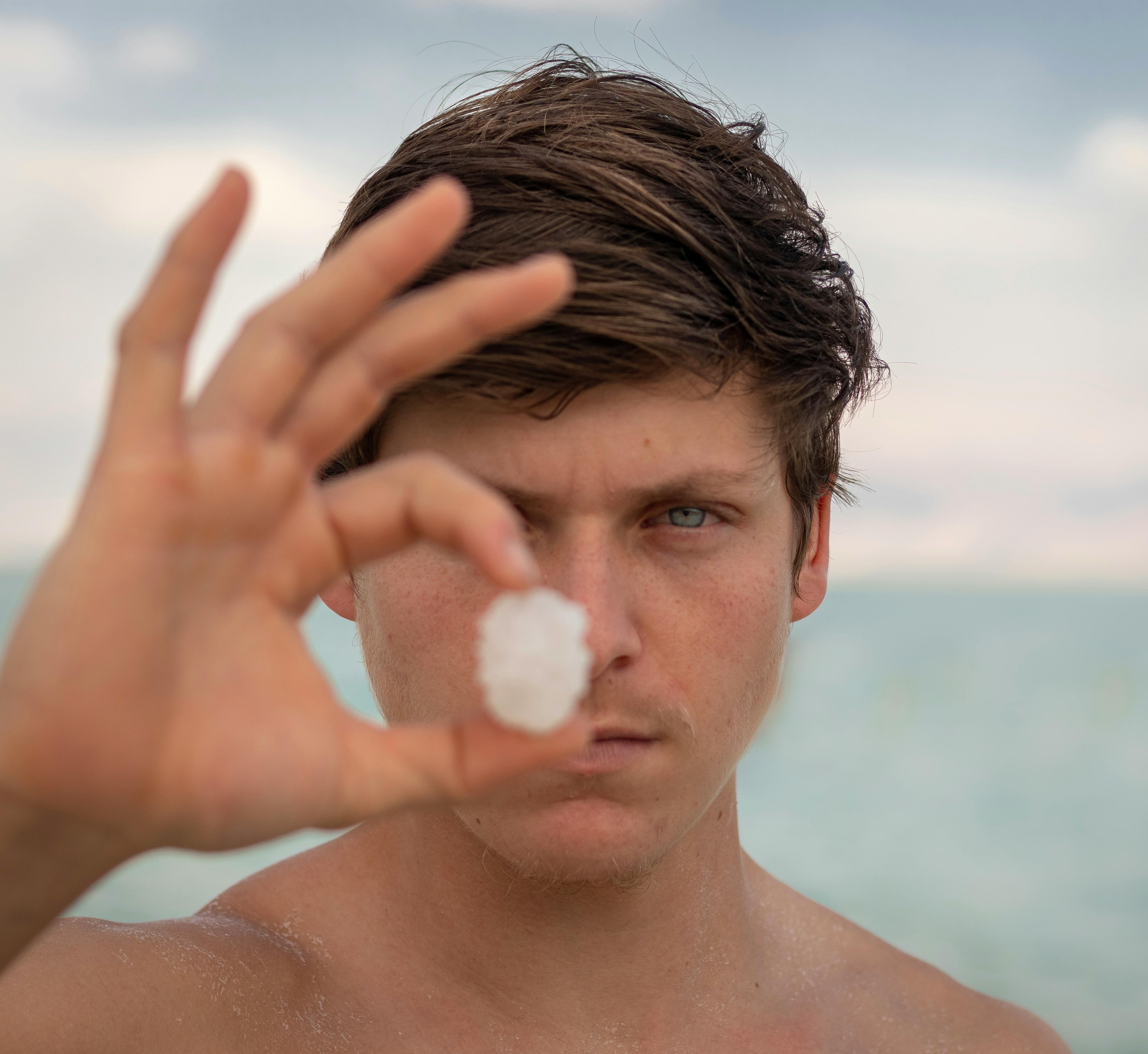 Portrait of Man Holding Stone in Hand · Free Stock Photo
