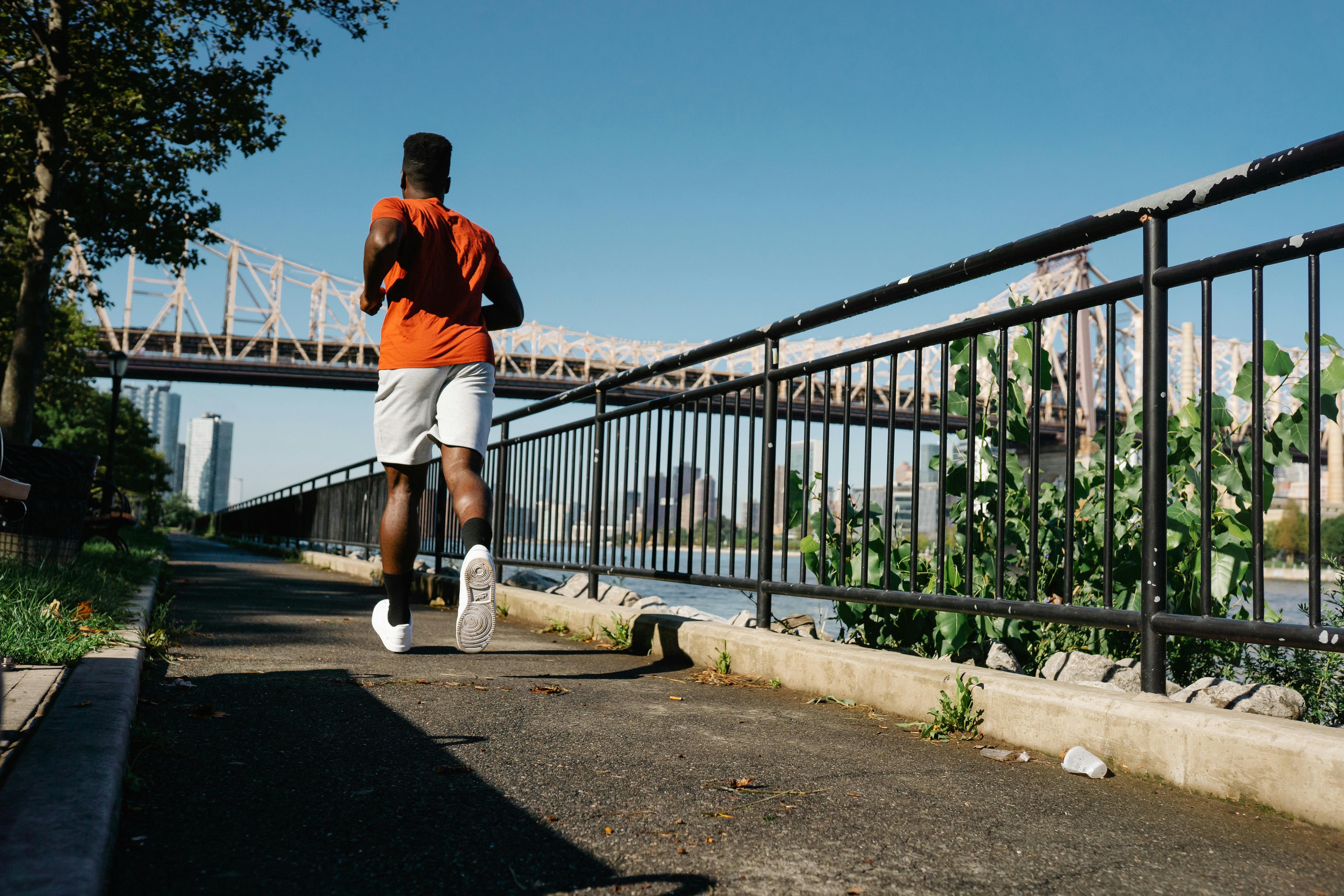 A Man Jogging on the Street · Free Stock Photo