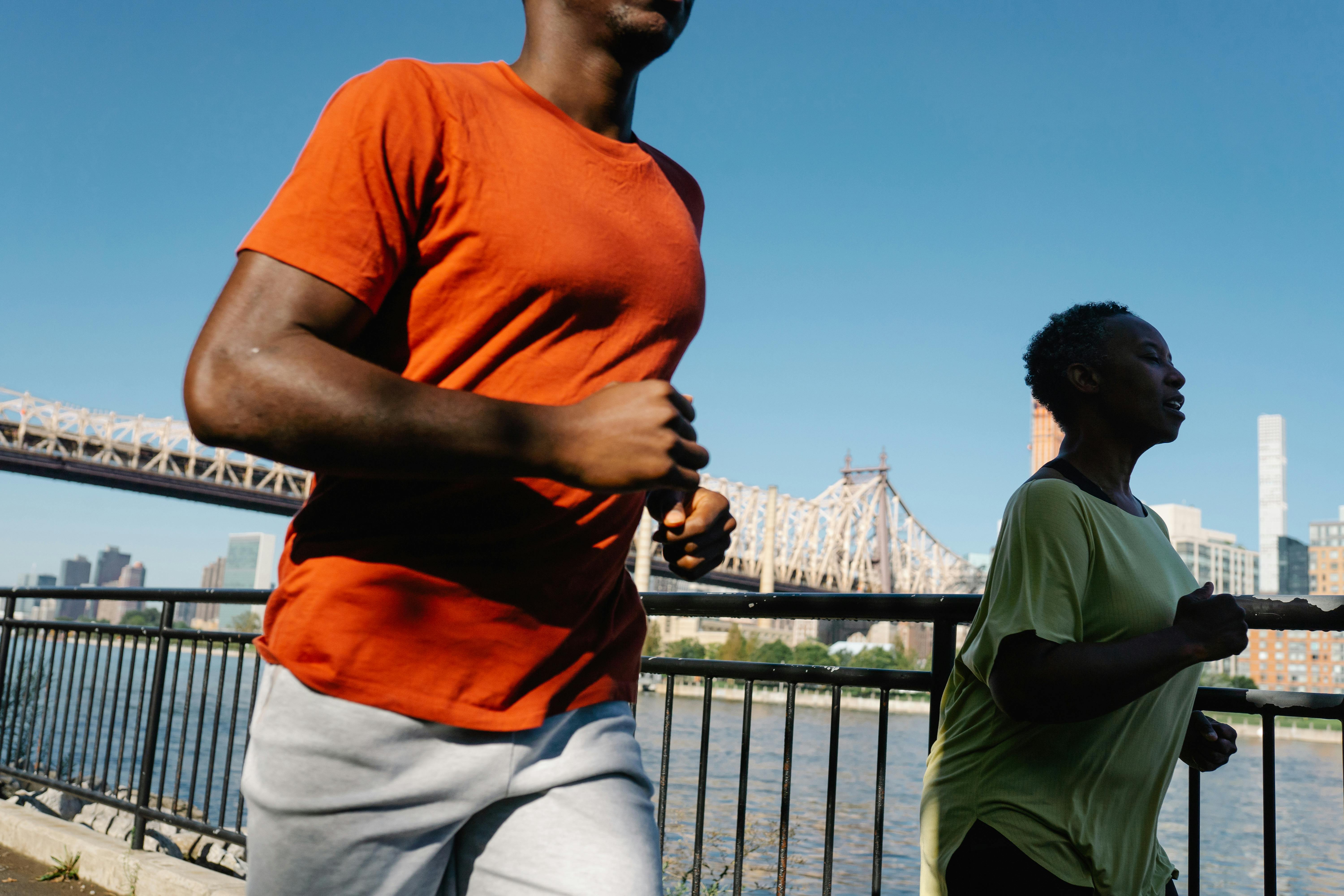 People Jogging Near the Bridge · Free Stock Photo