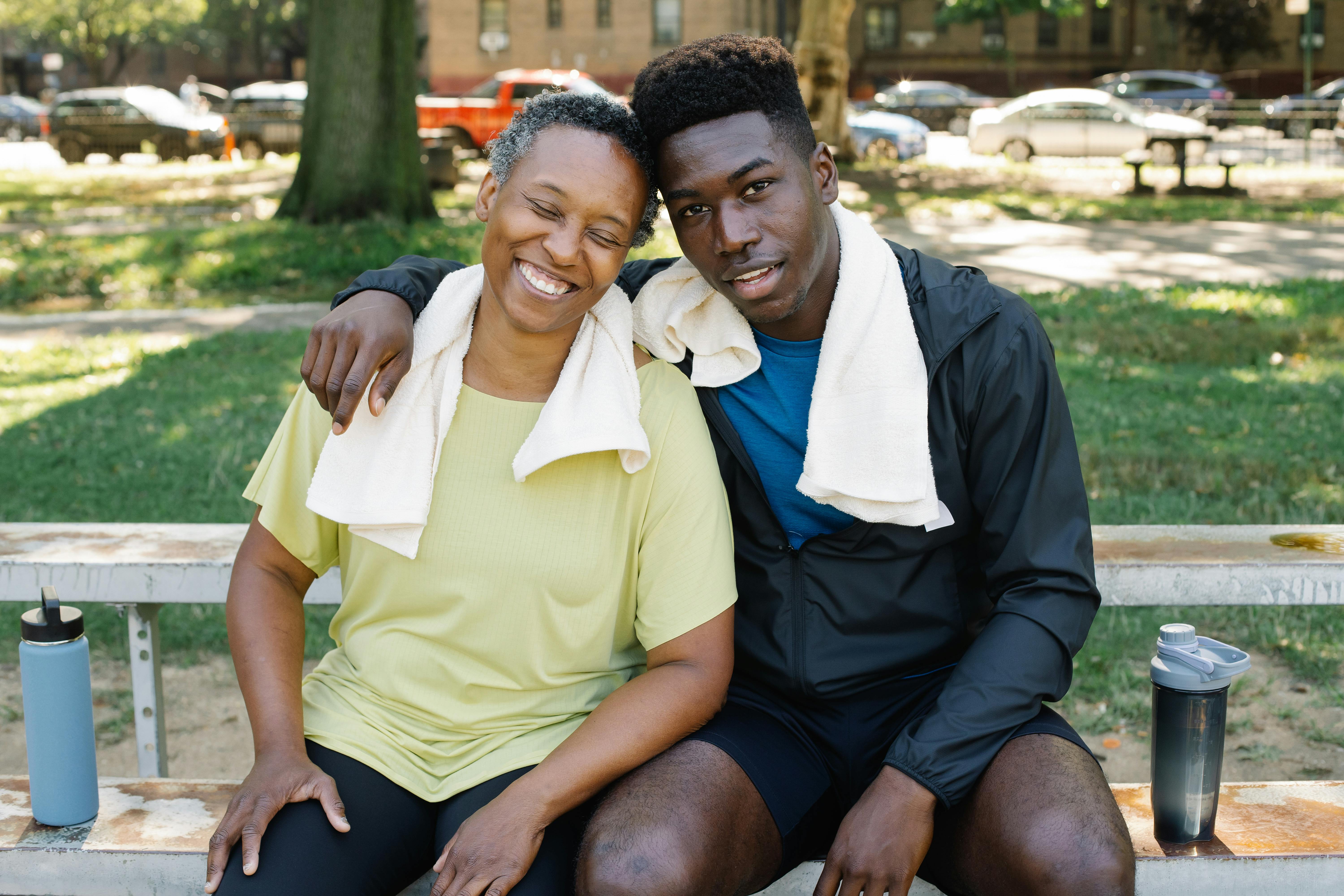 Couple Hugging on Bench · Free Stock Photo