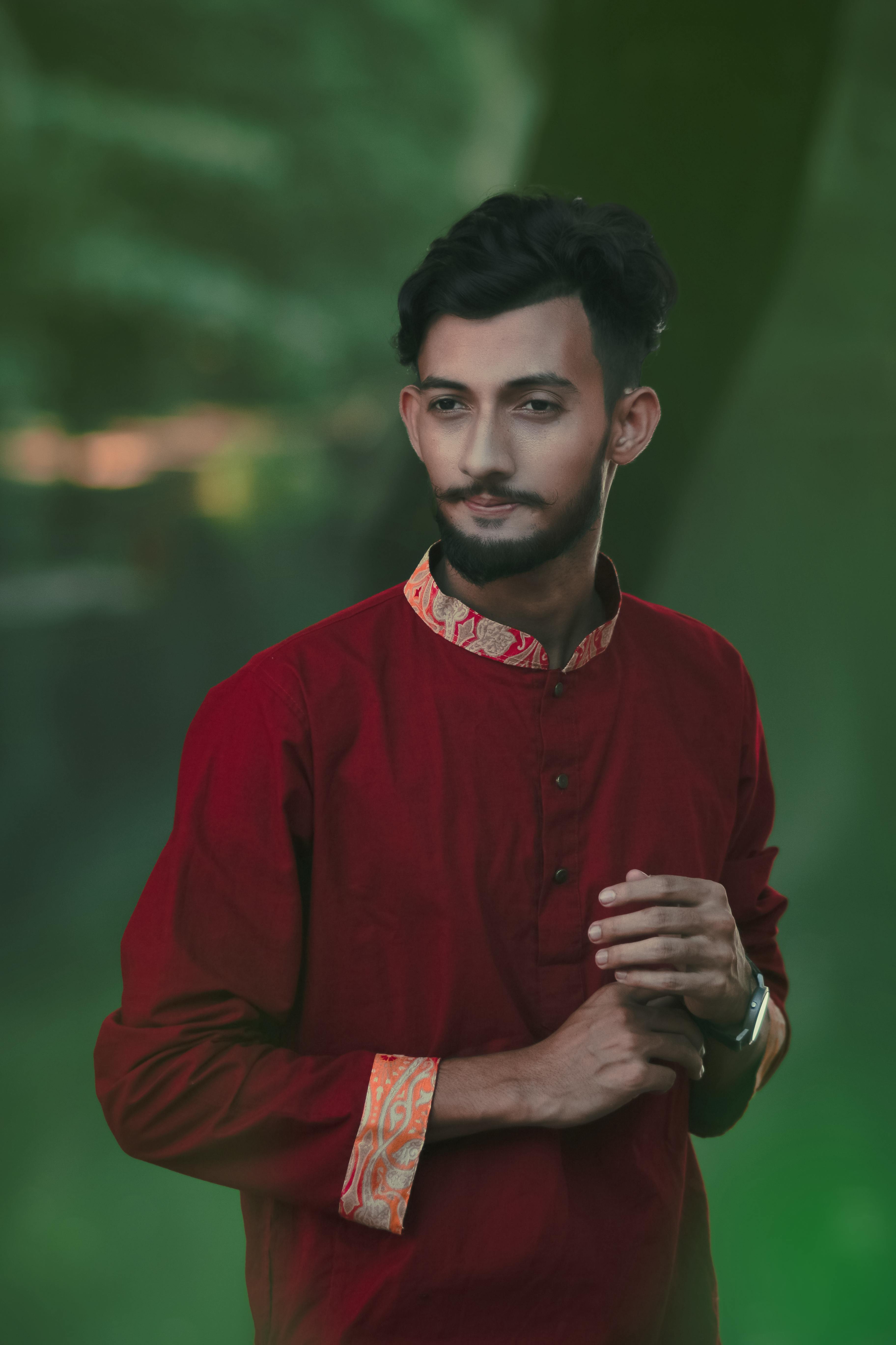Two Men Wearing Plaid Shirts Standing Beside a Blue Car · Free Stock Photo