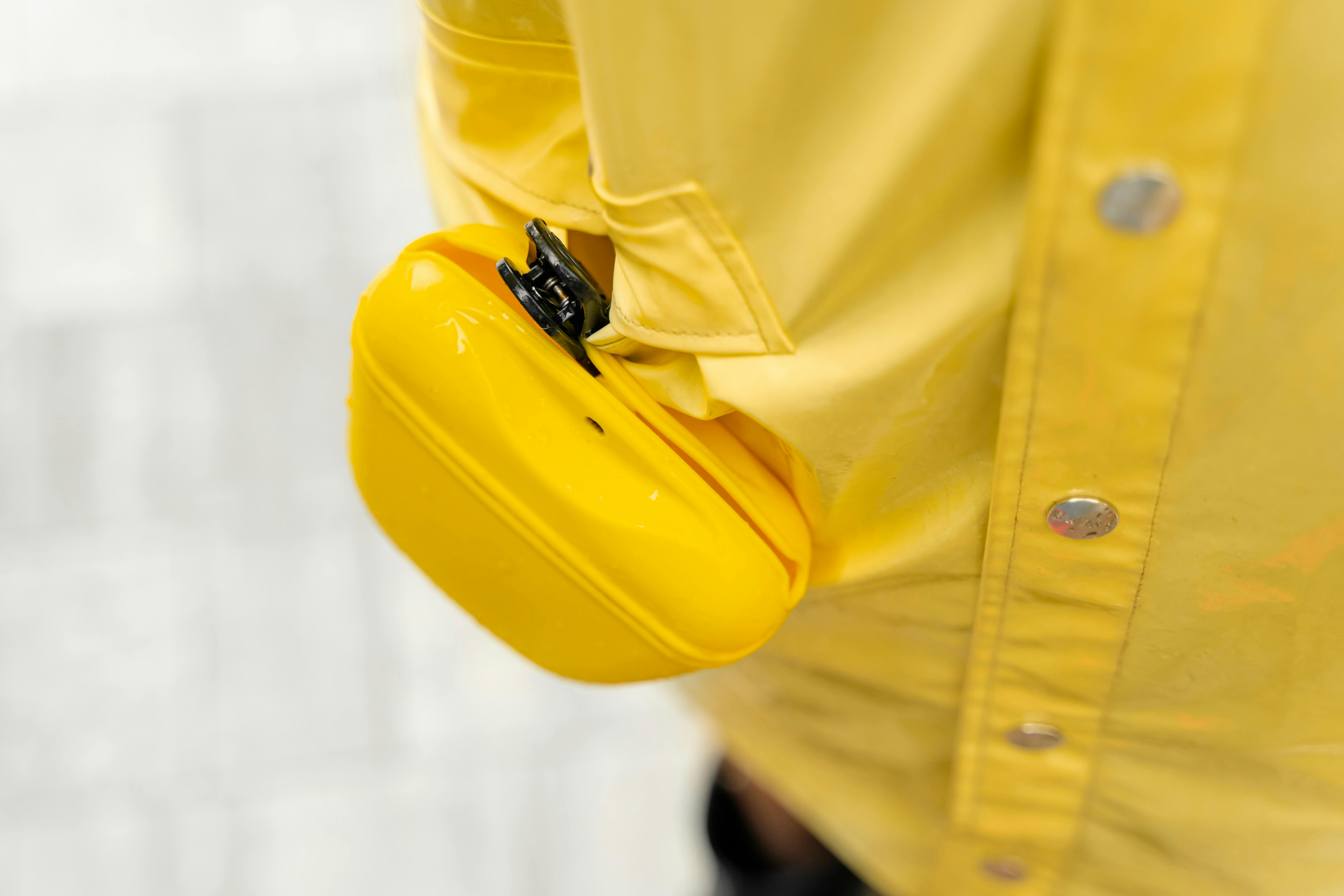 Close-Up Shot of Black Clip on Yellow Bag · Free Stock Photo