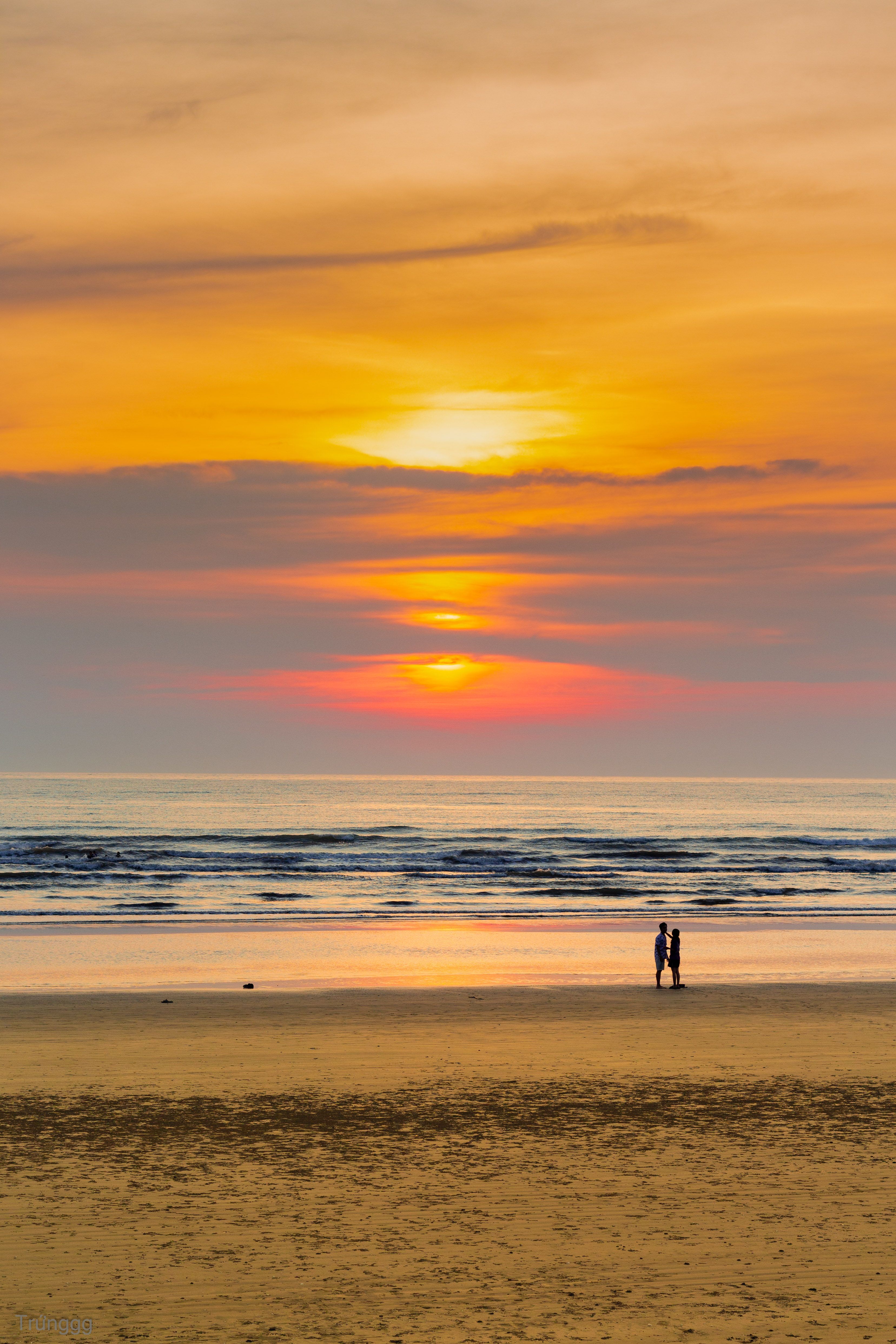 Couple on Beach at Sunset · Free Stock Photo