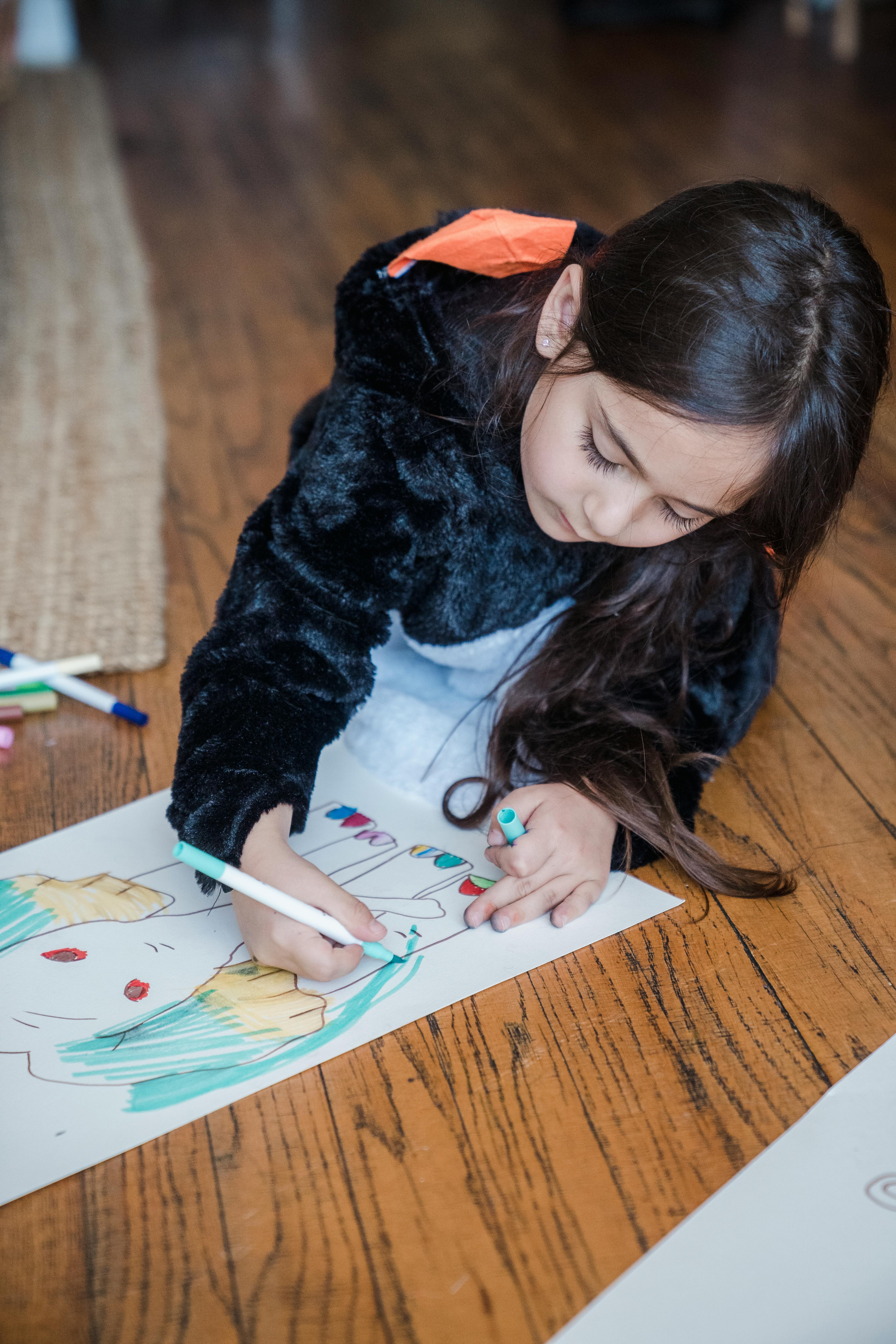 Child Sitting on Floor Drawing · Free Stock Photo
