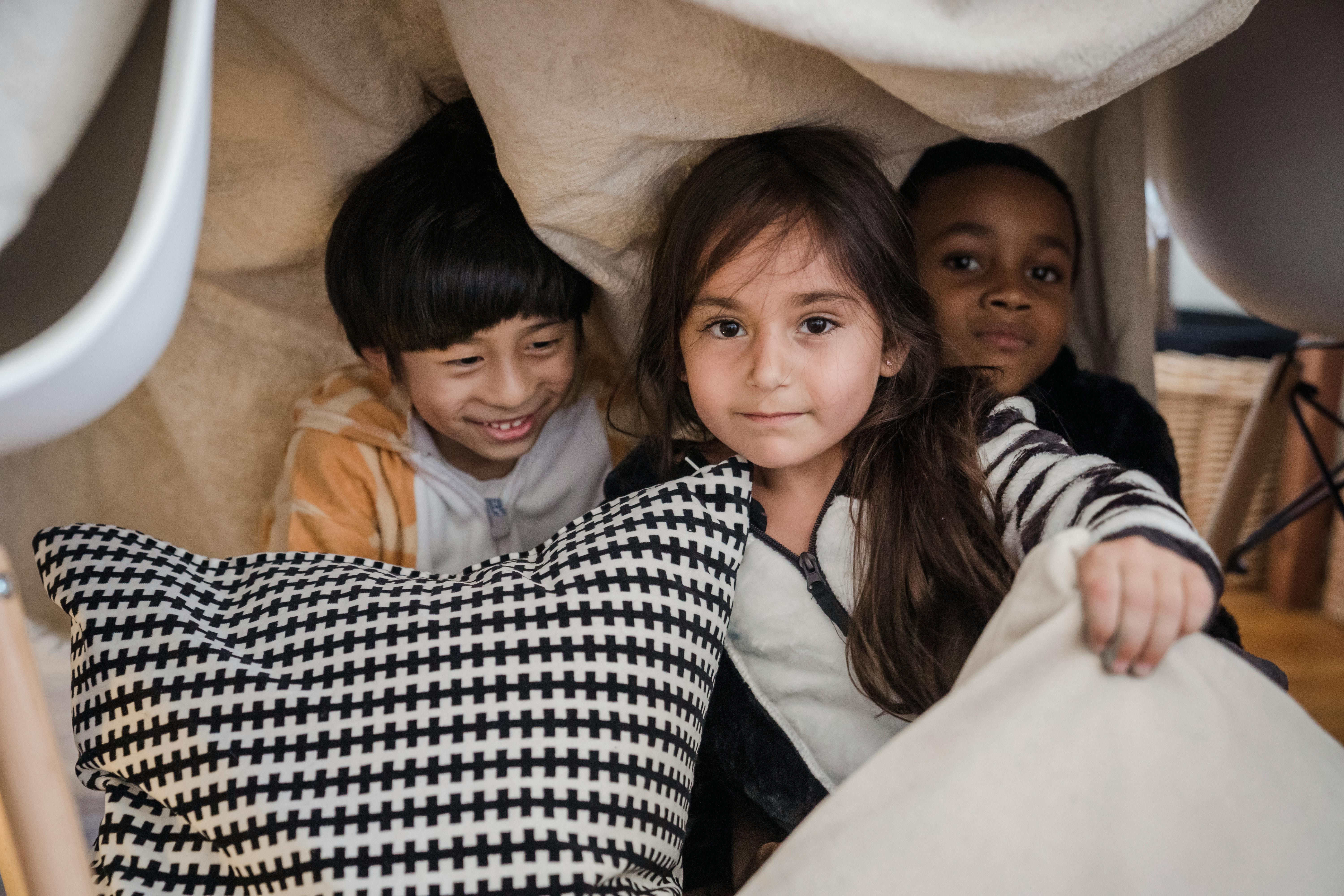 Kids Under the Blanket Playing Together · Free Stock Photo