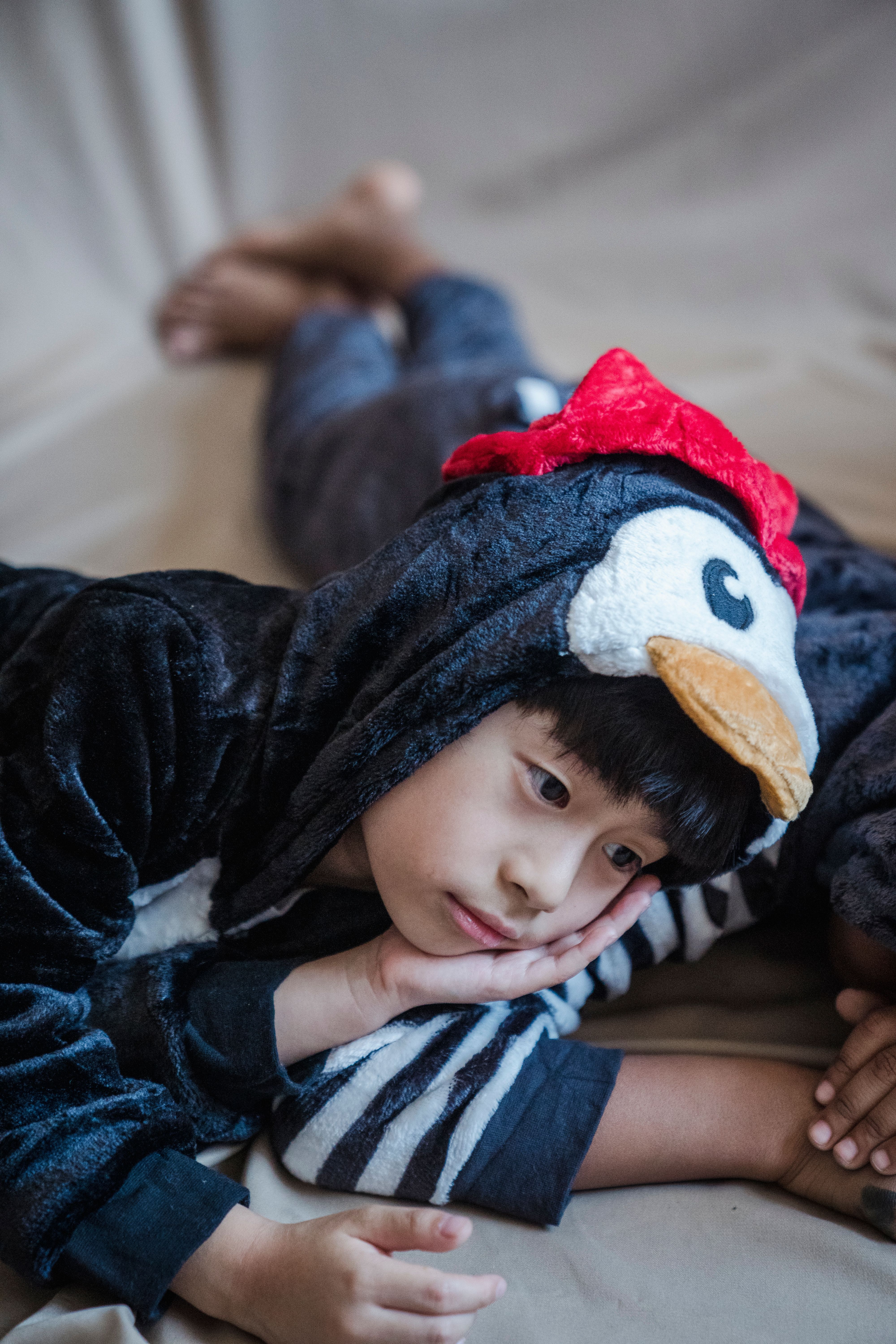 Photo of a Boy with His Hand on His Cheek · Free Stock Photo