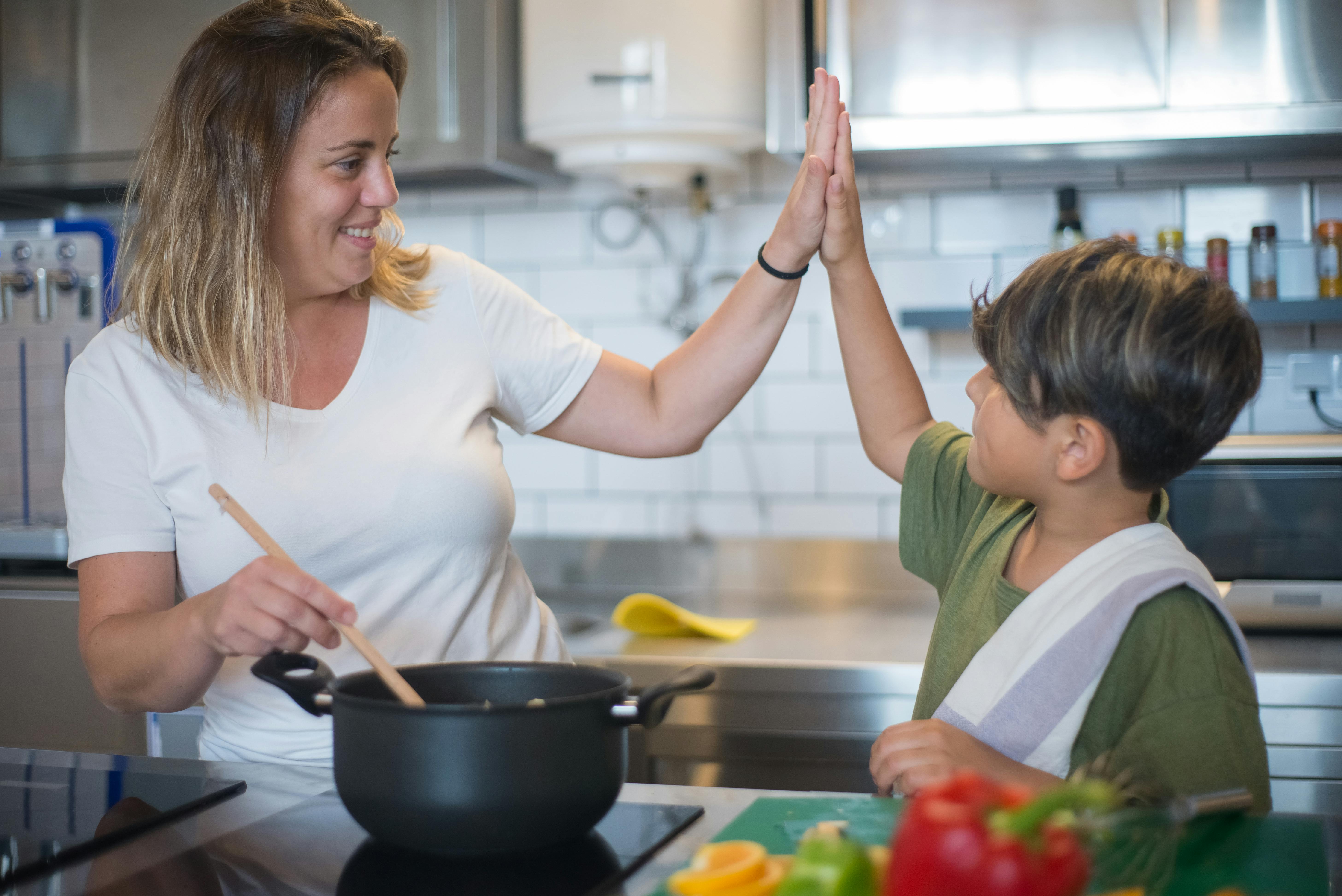 Mother and Child Preparing Crepes · Free Stock Photo