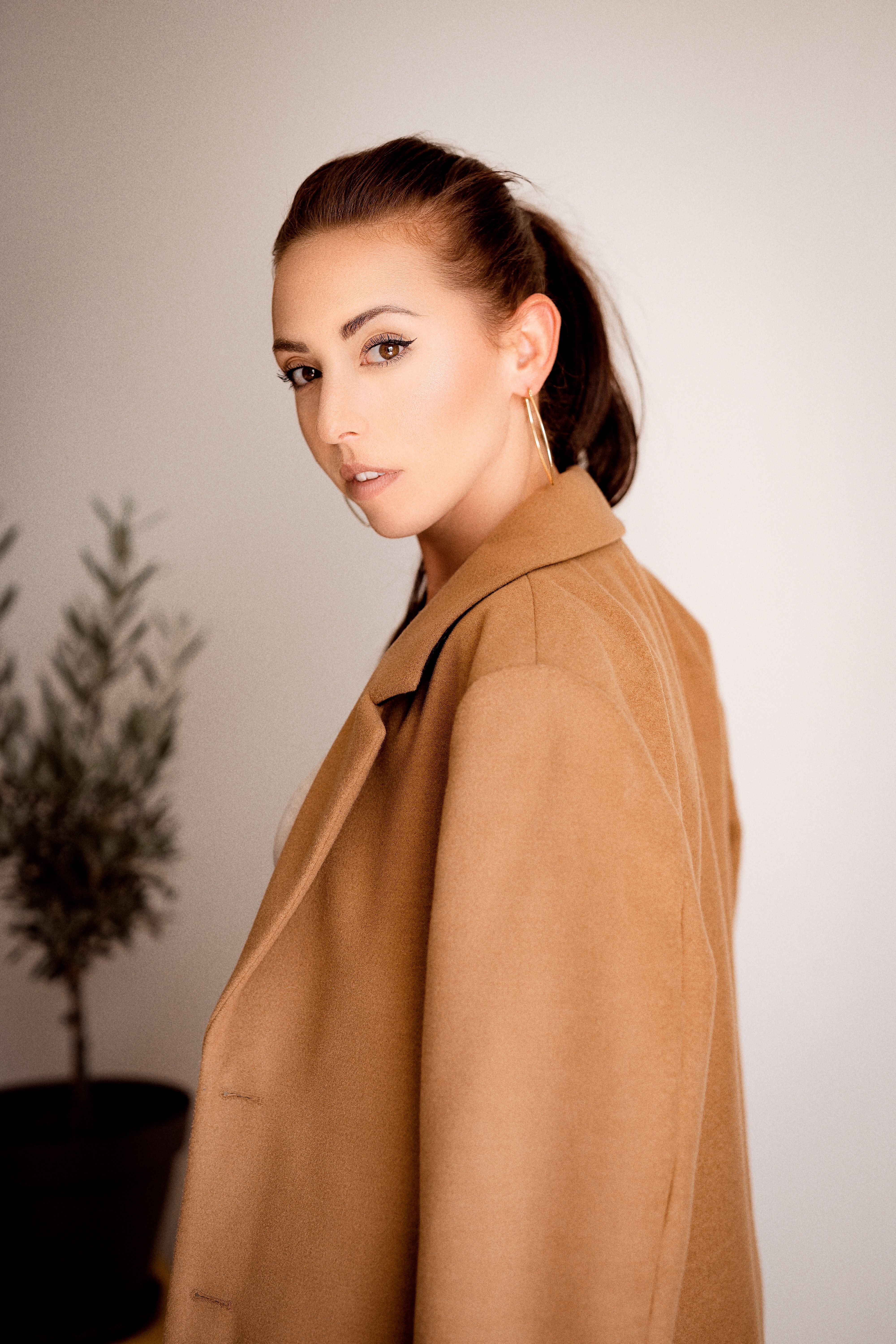 A Pretty Woman in Brown Blazer · Free Stock Photo