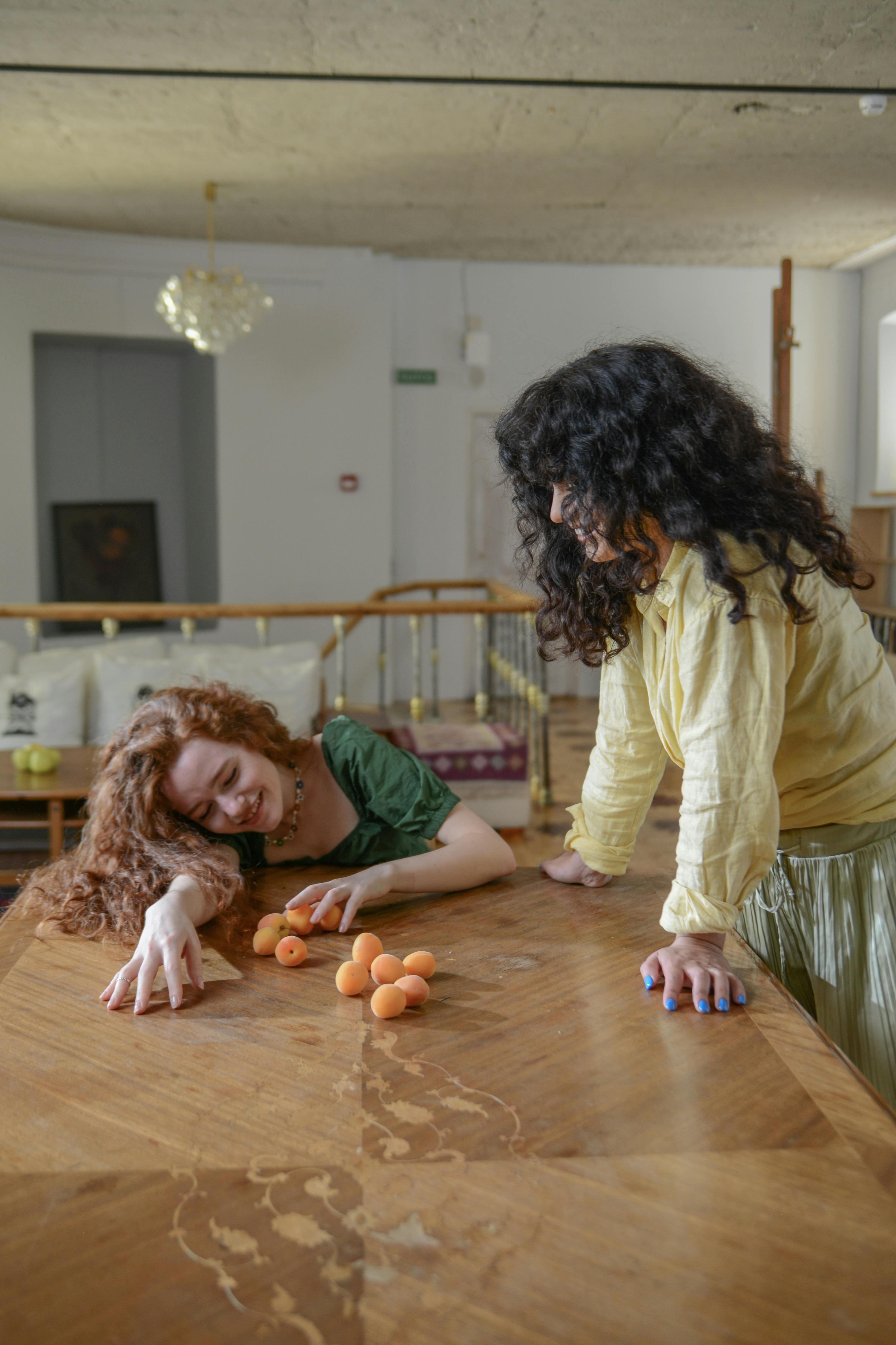 Young Women at Table in Morning · Free Stock Photo