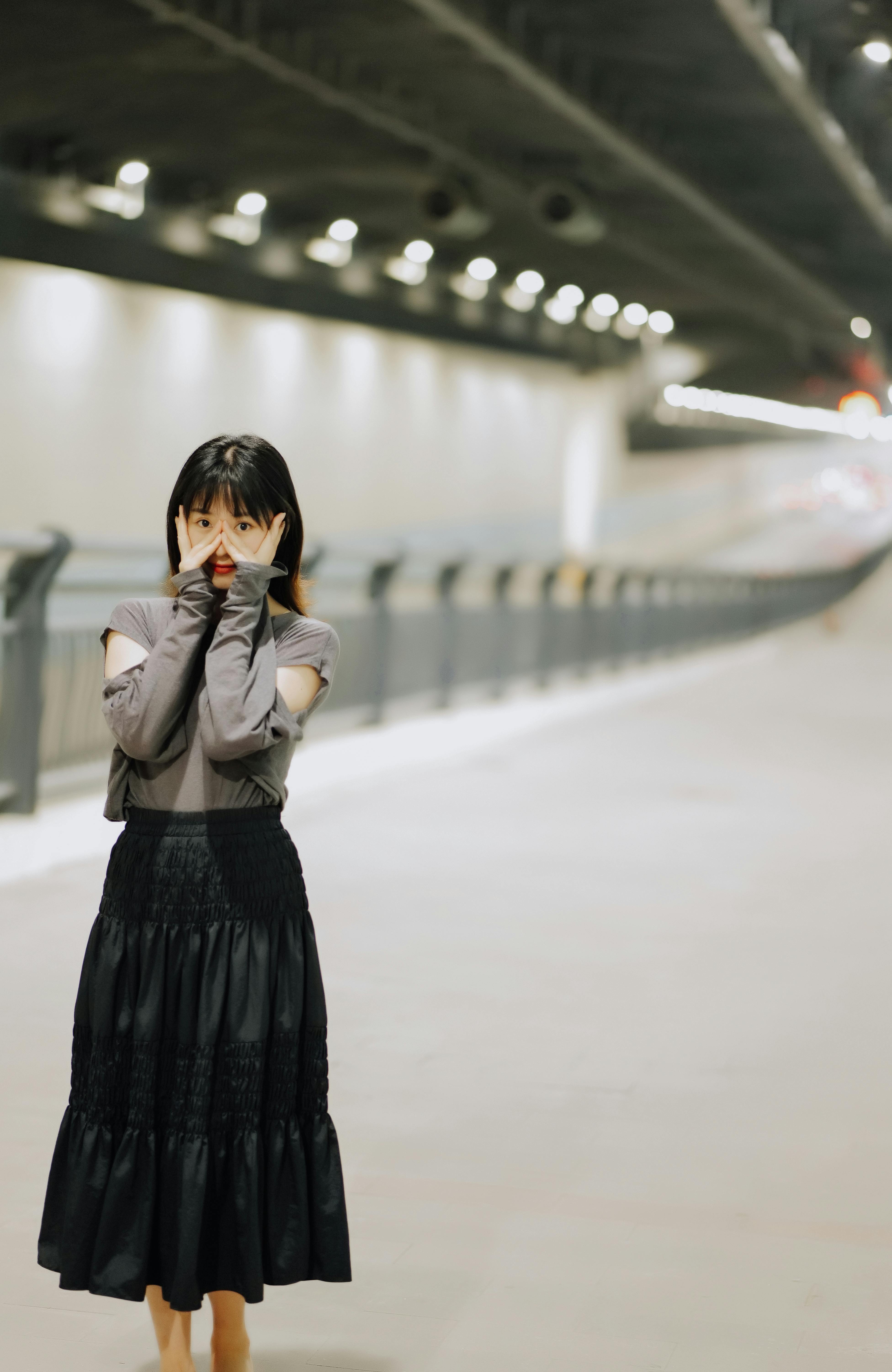 Cute Girl Standing with Hands on her Face · Free Stock Photo