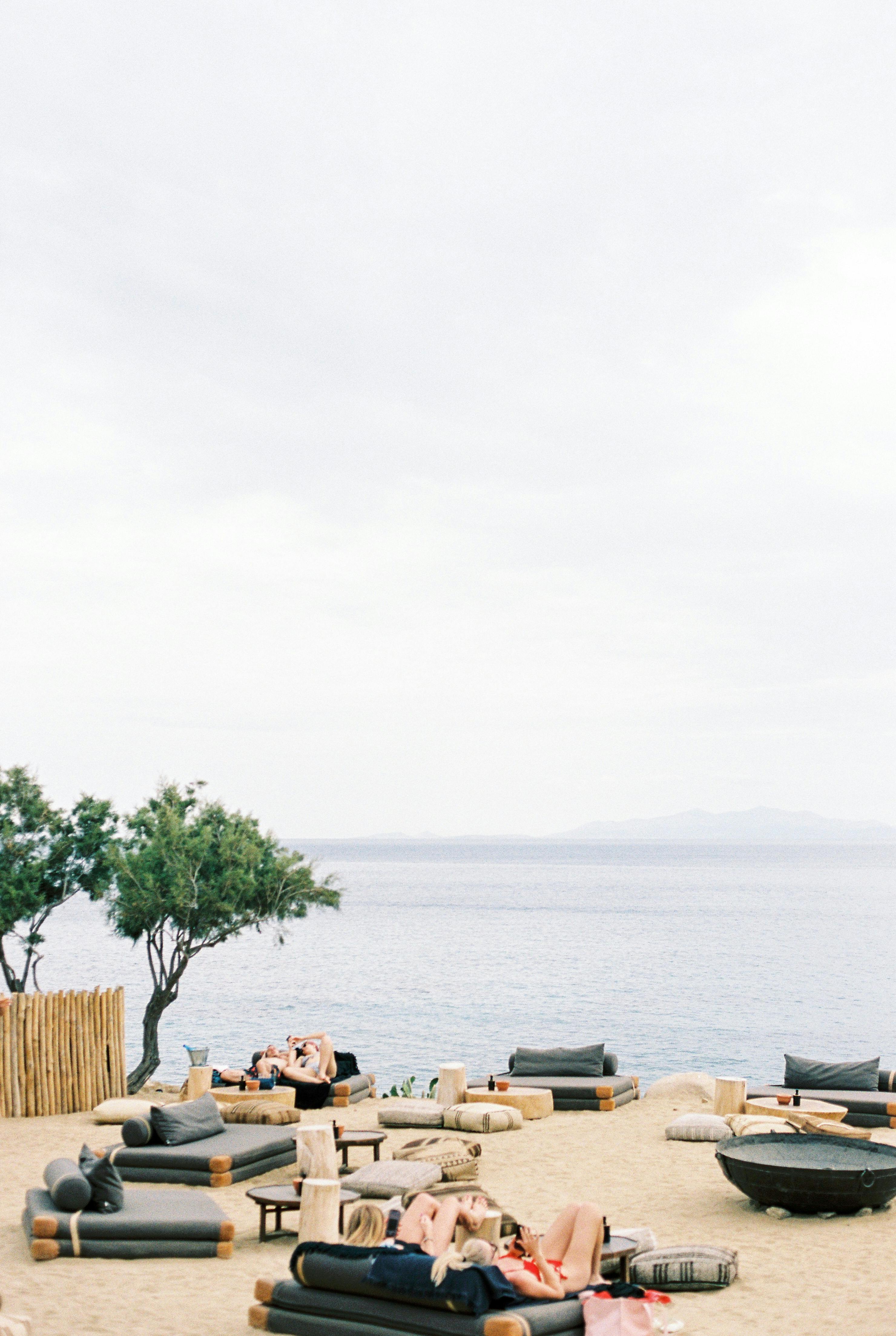 People Relaxing on the Shore of the Beach · Free Stock Photo