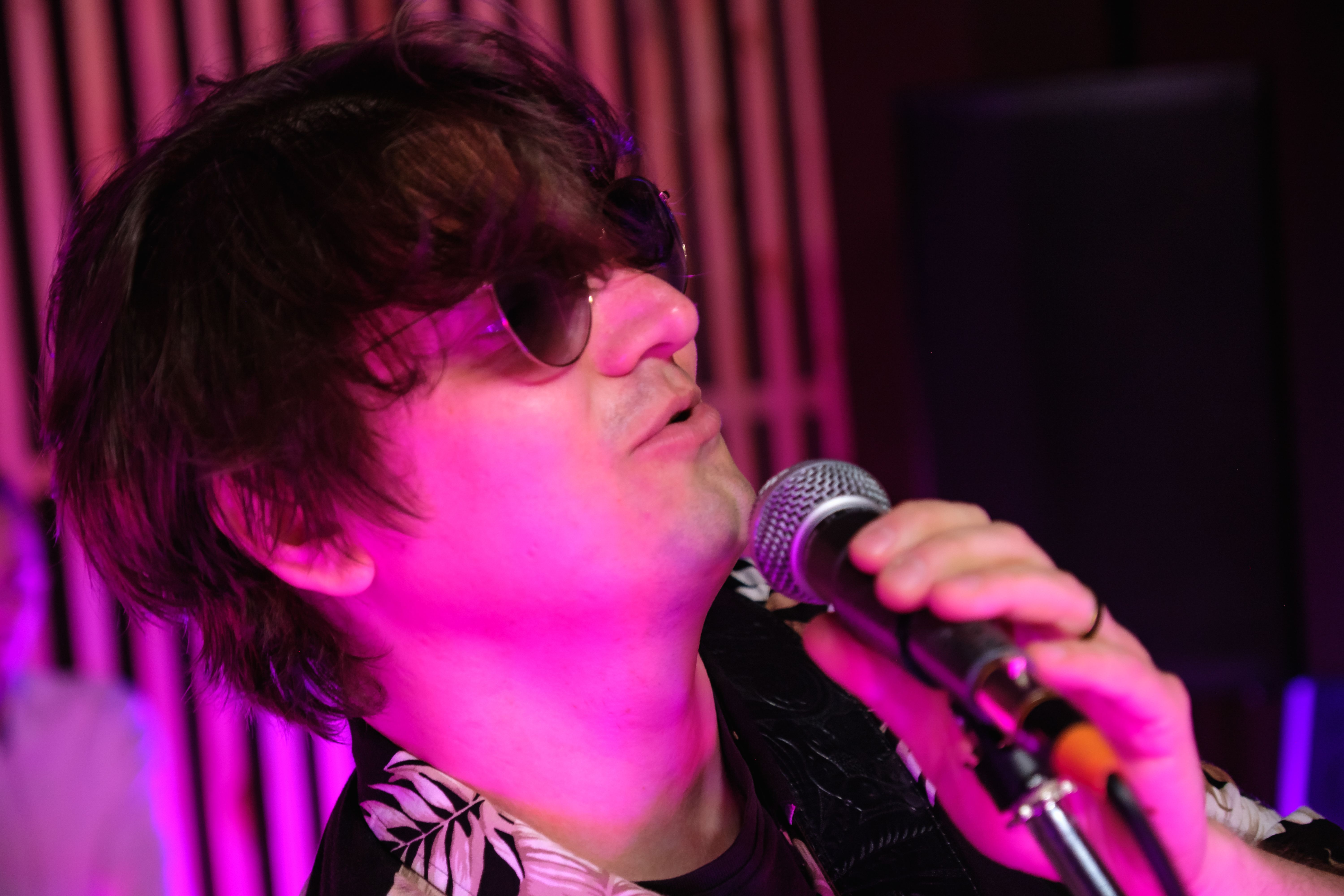 Close-Up Shot of a Woman Singing · Free Stock Photo