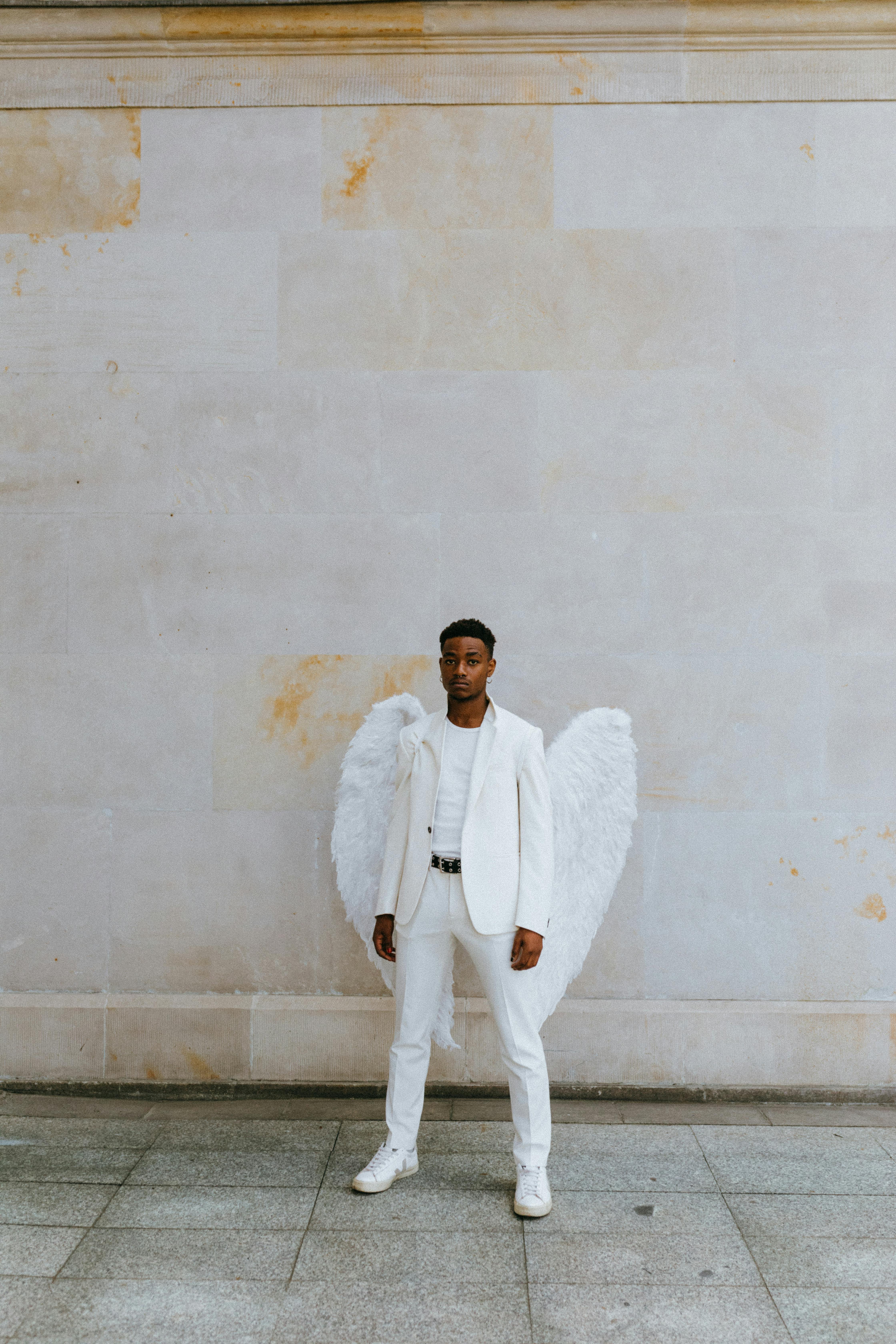 A Man Wearing an Angel Costume · Free Stock Photo