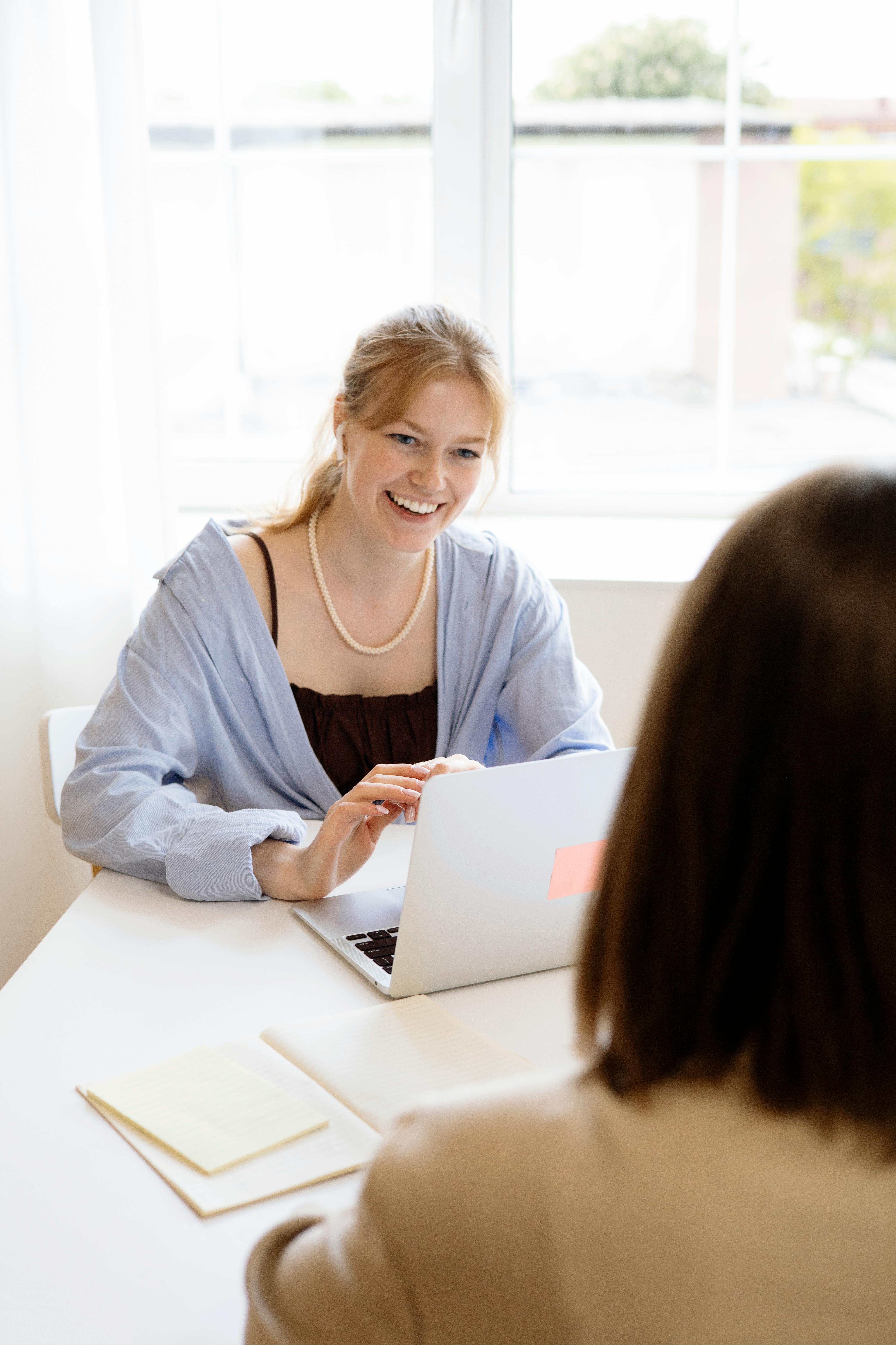 A Woman Sitting at the Table · Free Stock Photo