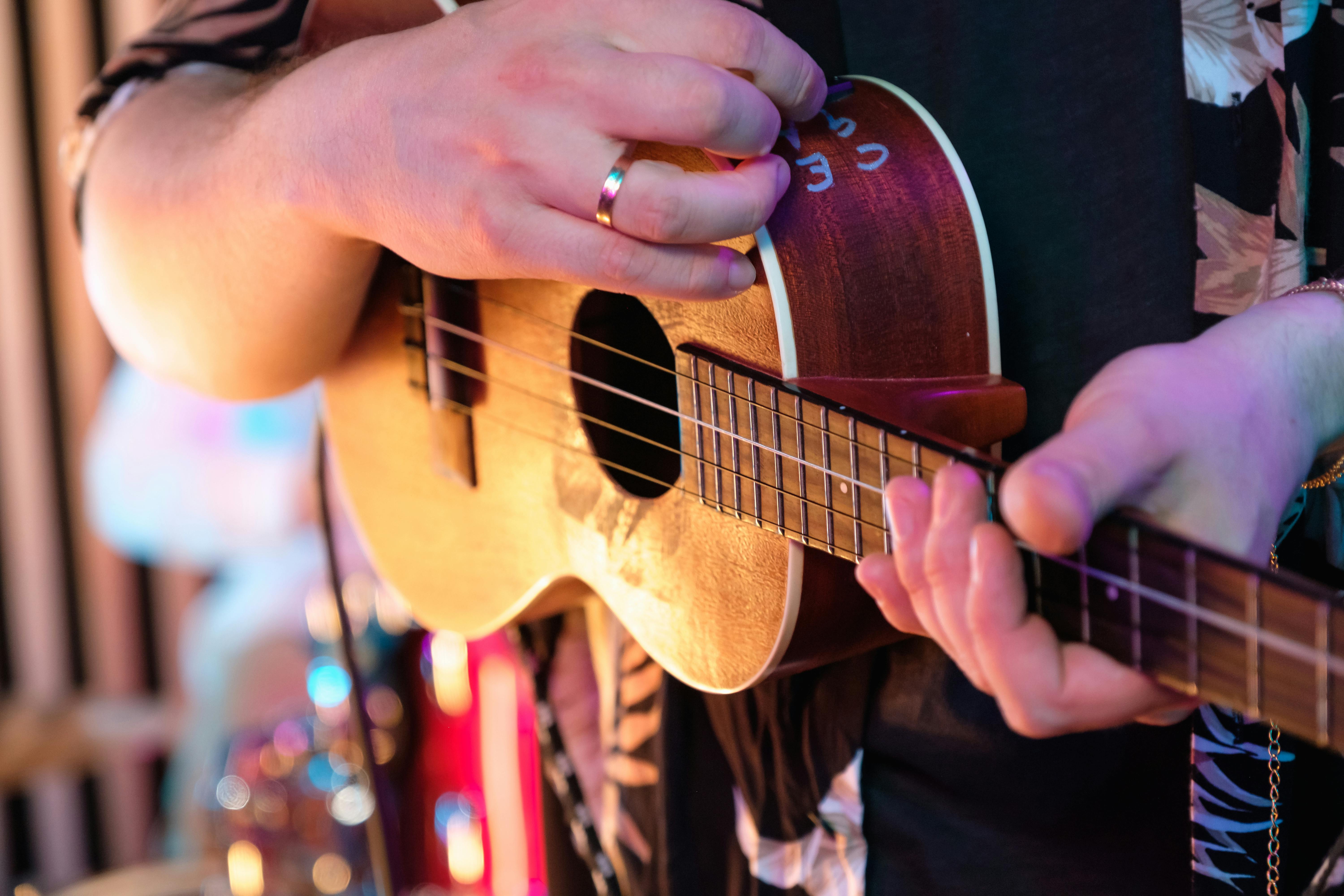 A Woman Playing the Ukulele · Free Stock Photo