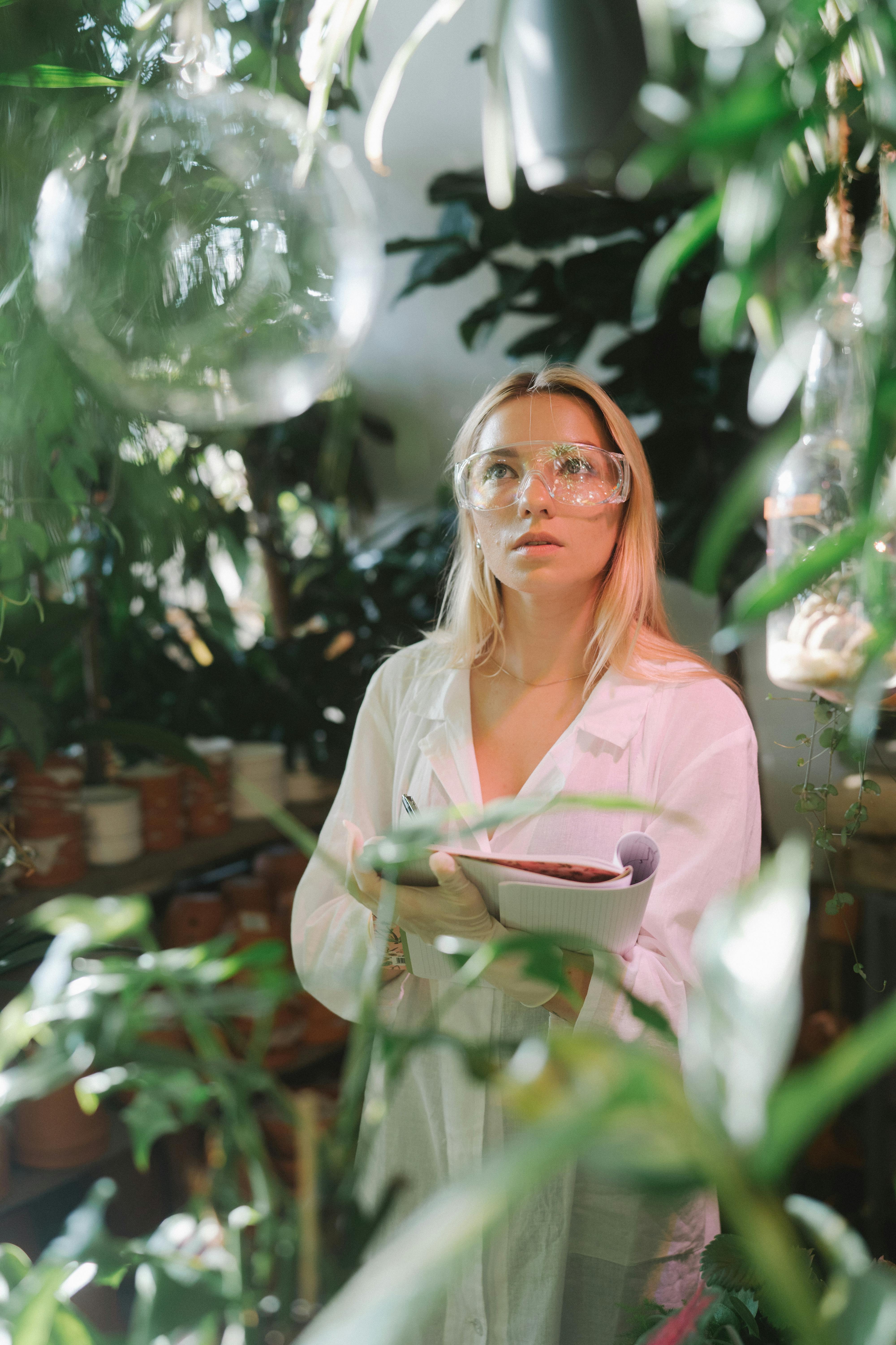 Pensive Female Botanist doing an Observation · Free Stock Photo
