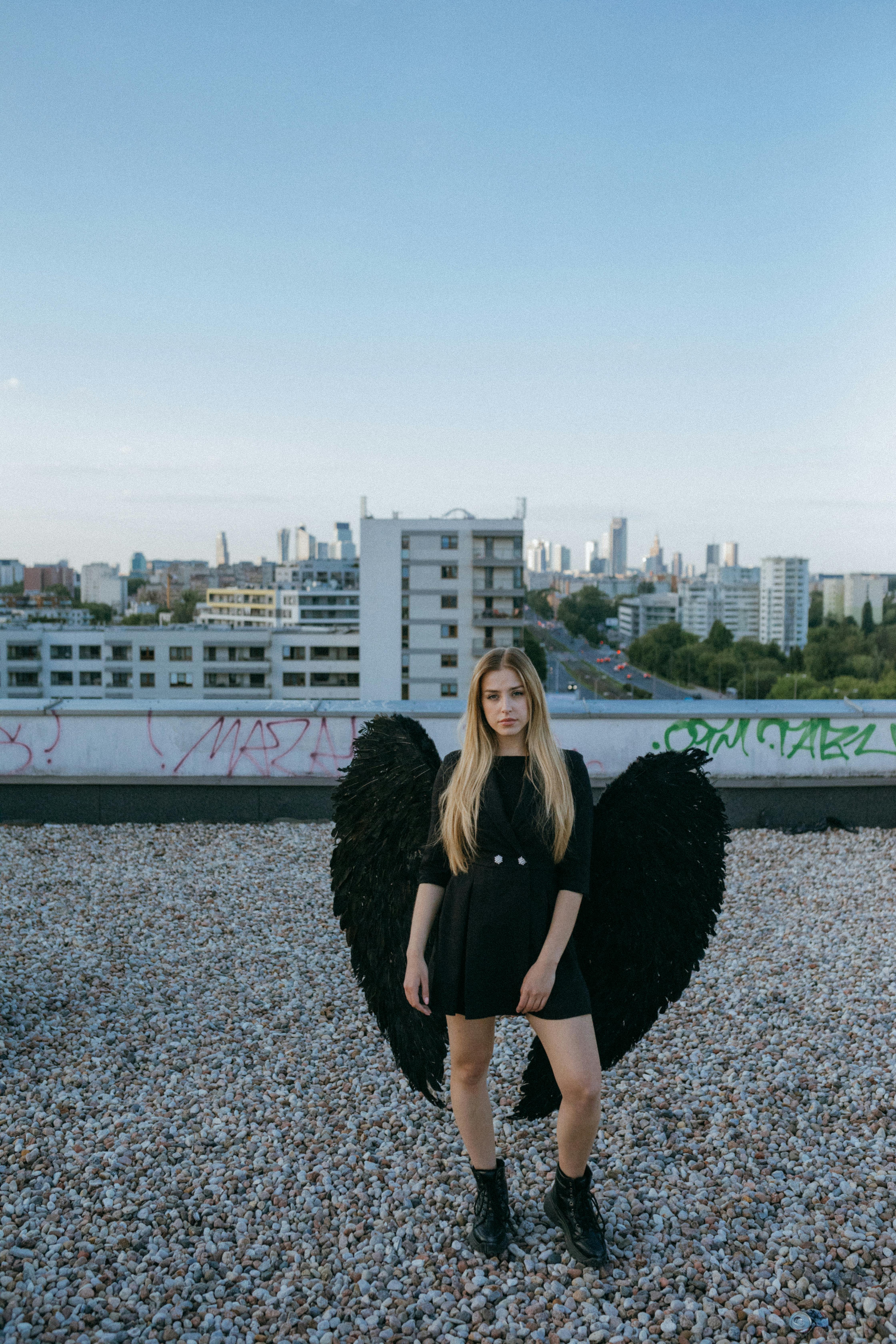 A Woman Wearing an Angel Costume · Free Stock Photo