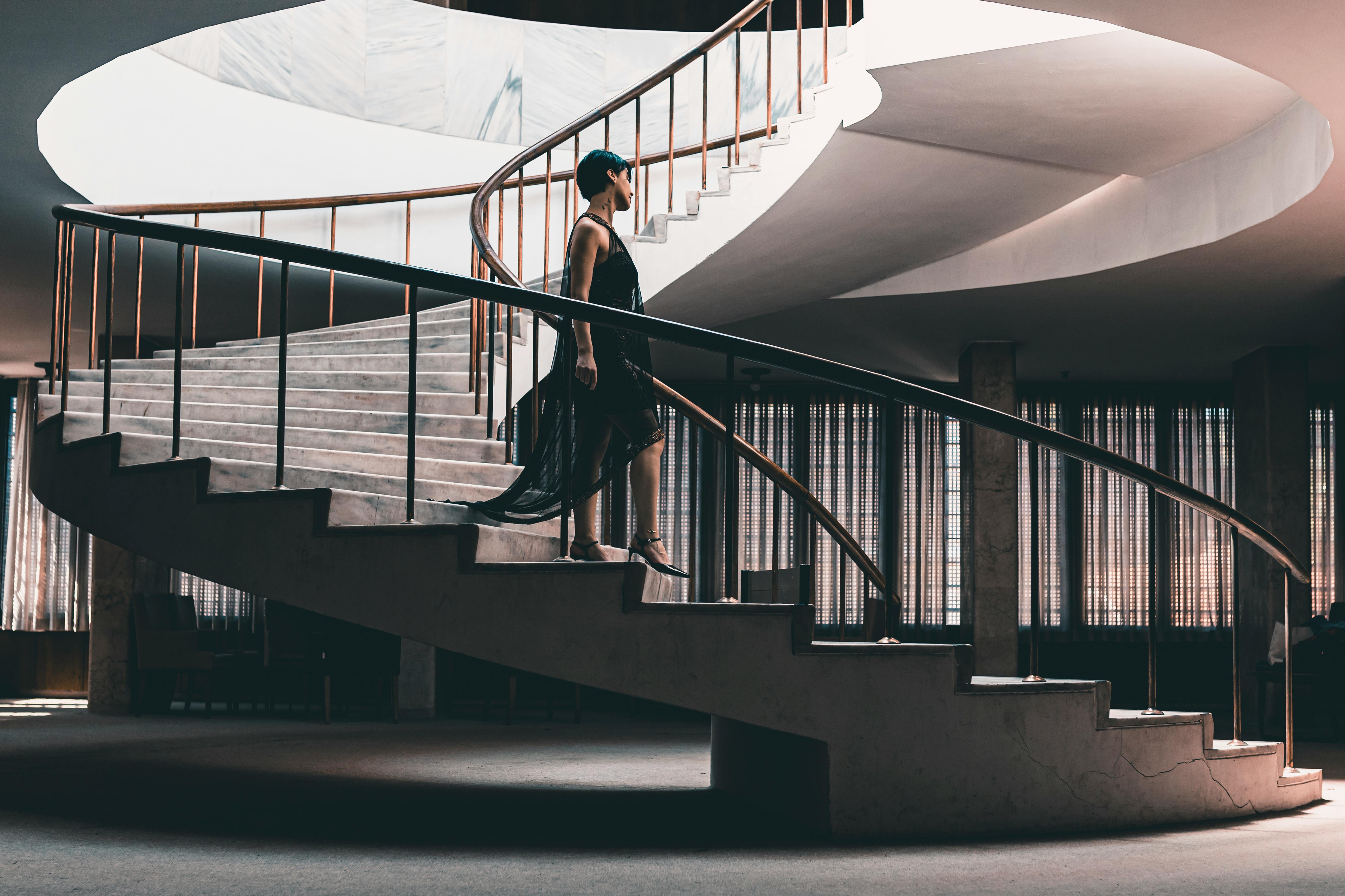 Back view of a Person Walking up the Stairs inside a Building · Free ...