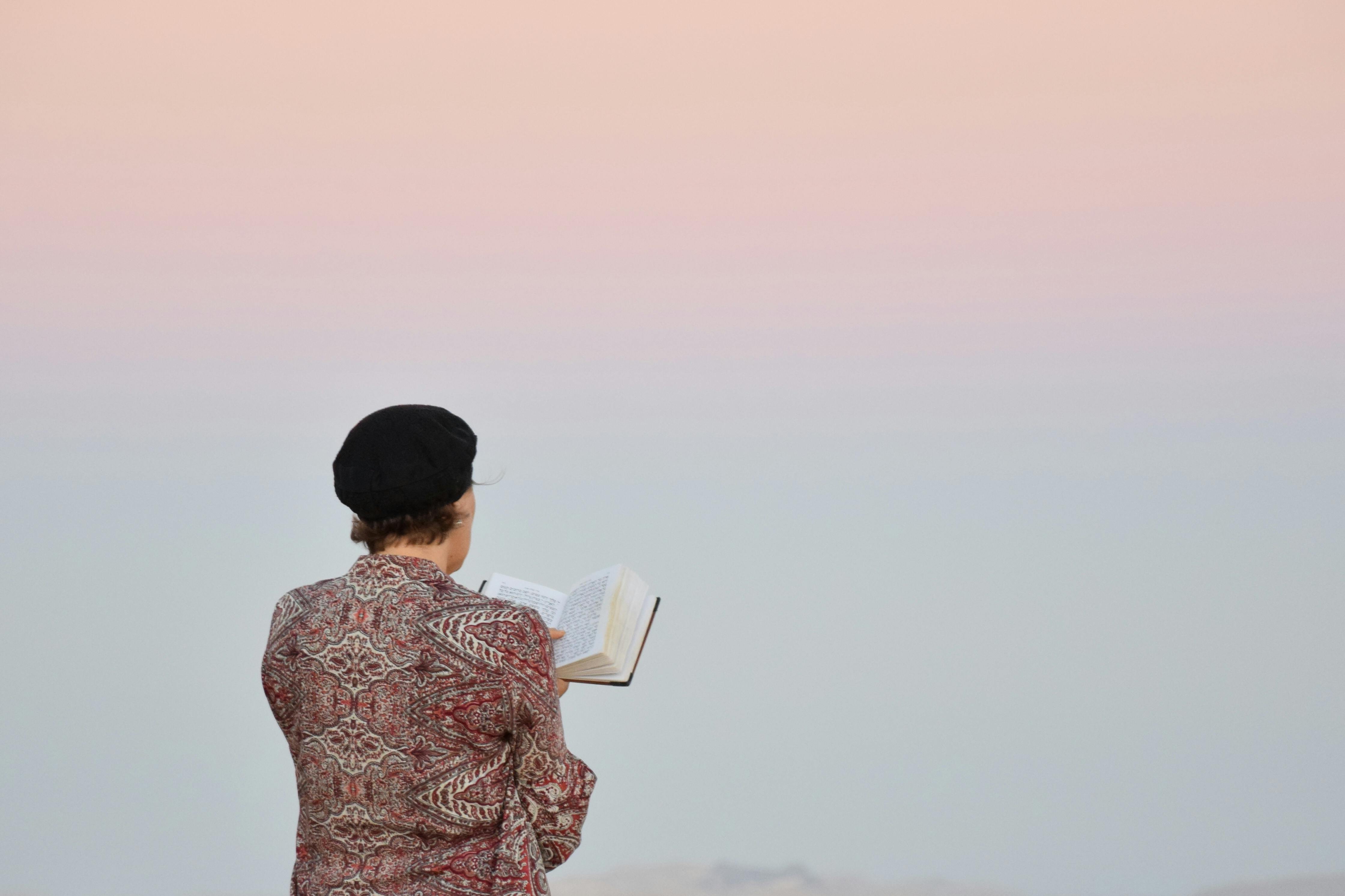 Back View of Woman Reading Book · Free Stock Photo