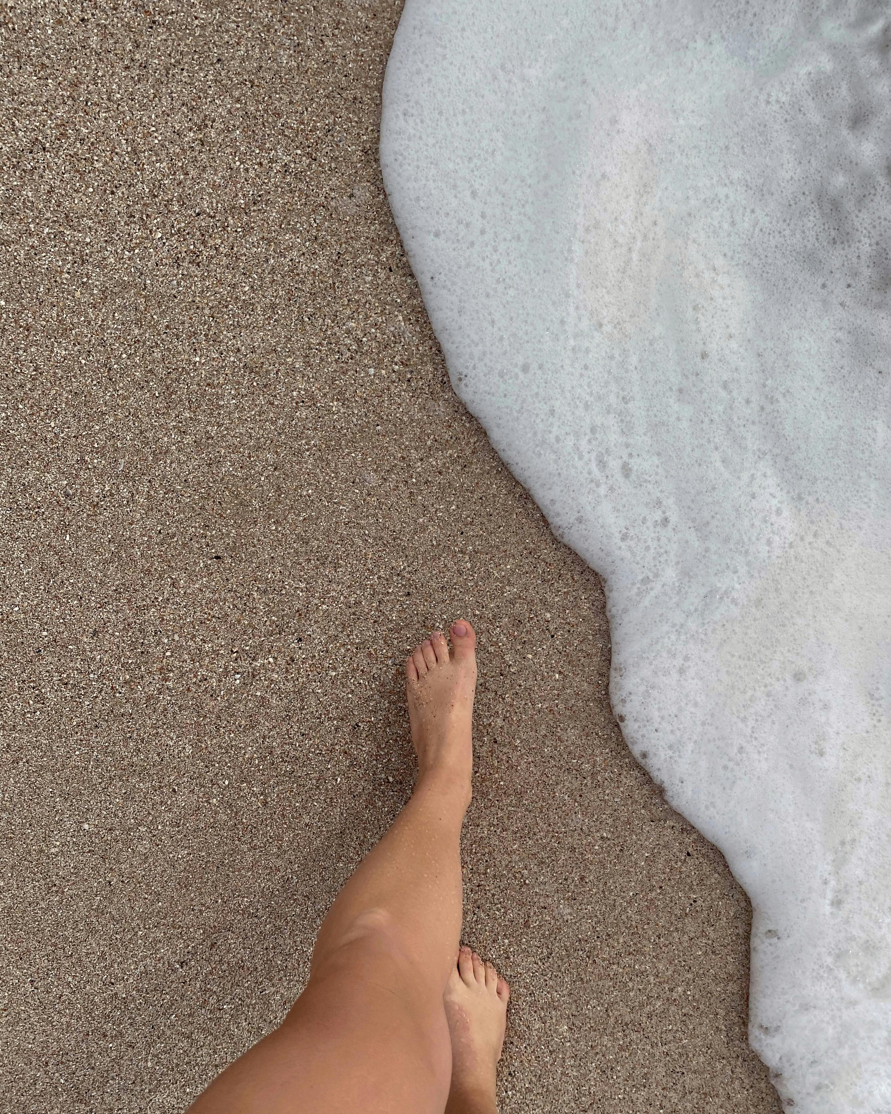 Person's Foot on Beach Sand · Free Stock Photo