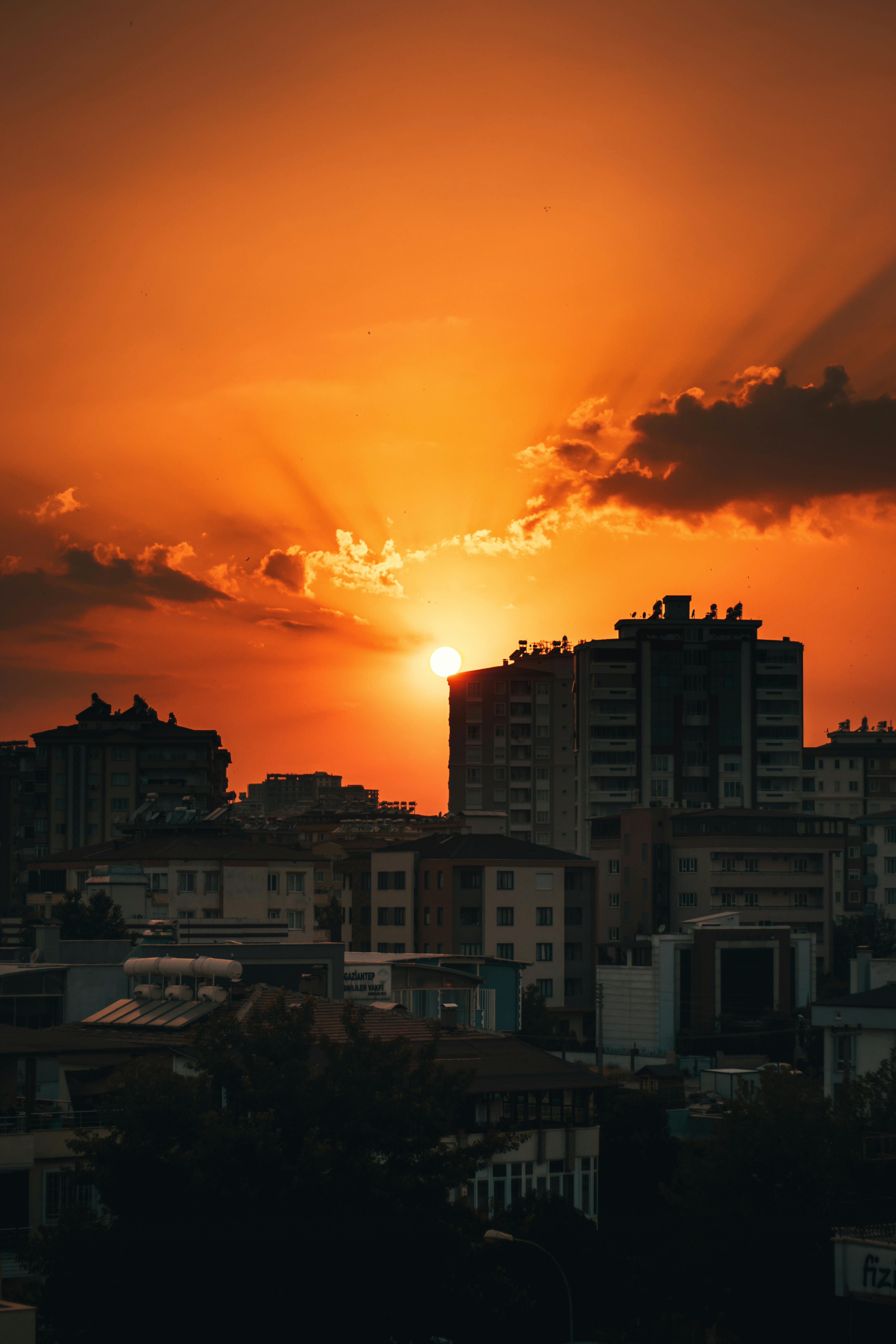 Sunset Behind the Buildings in a Town · Free Stock Photo