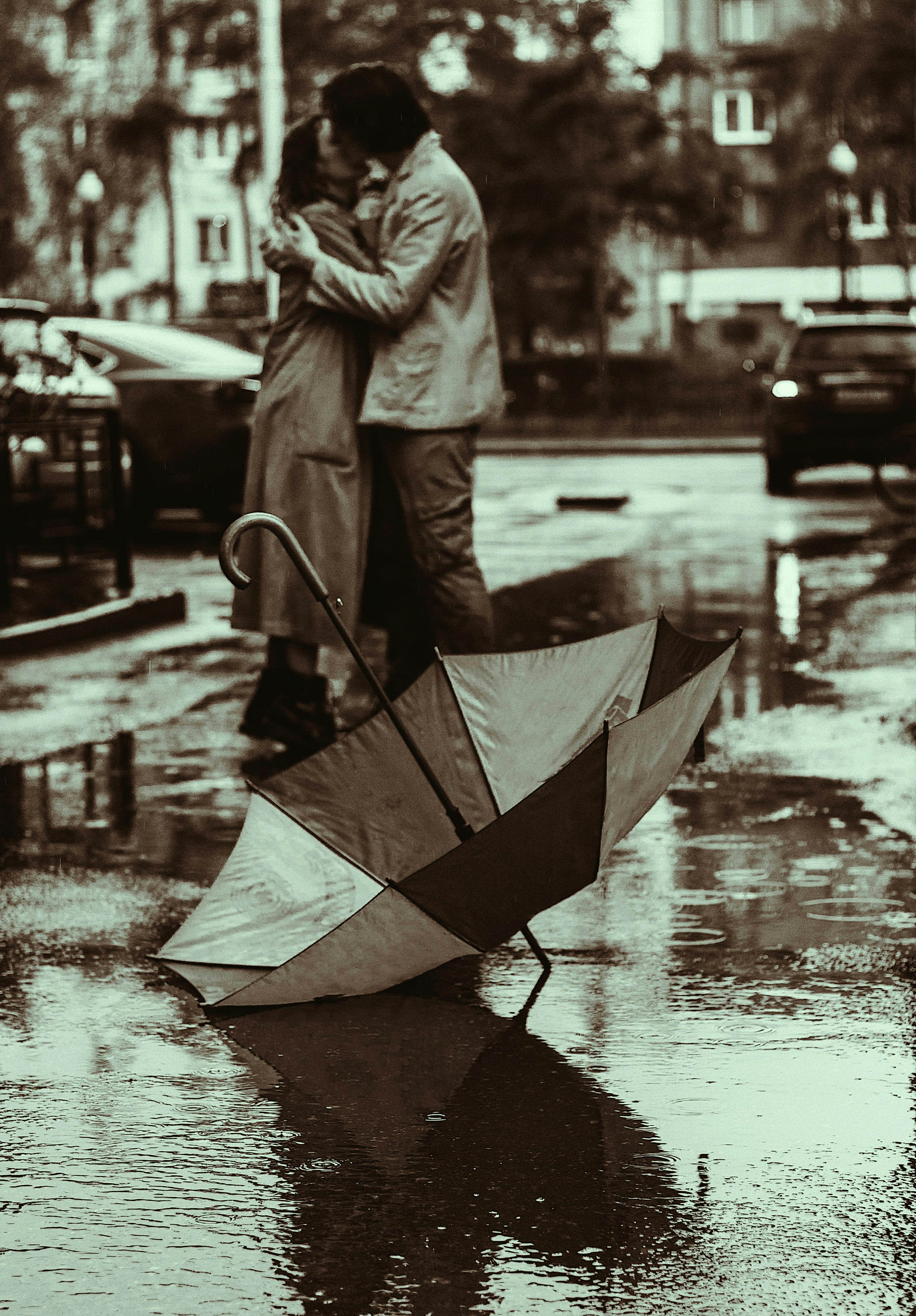 Man and Woman Hugging in the Rain · Free Stock Photo