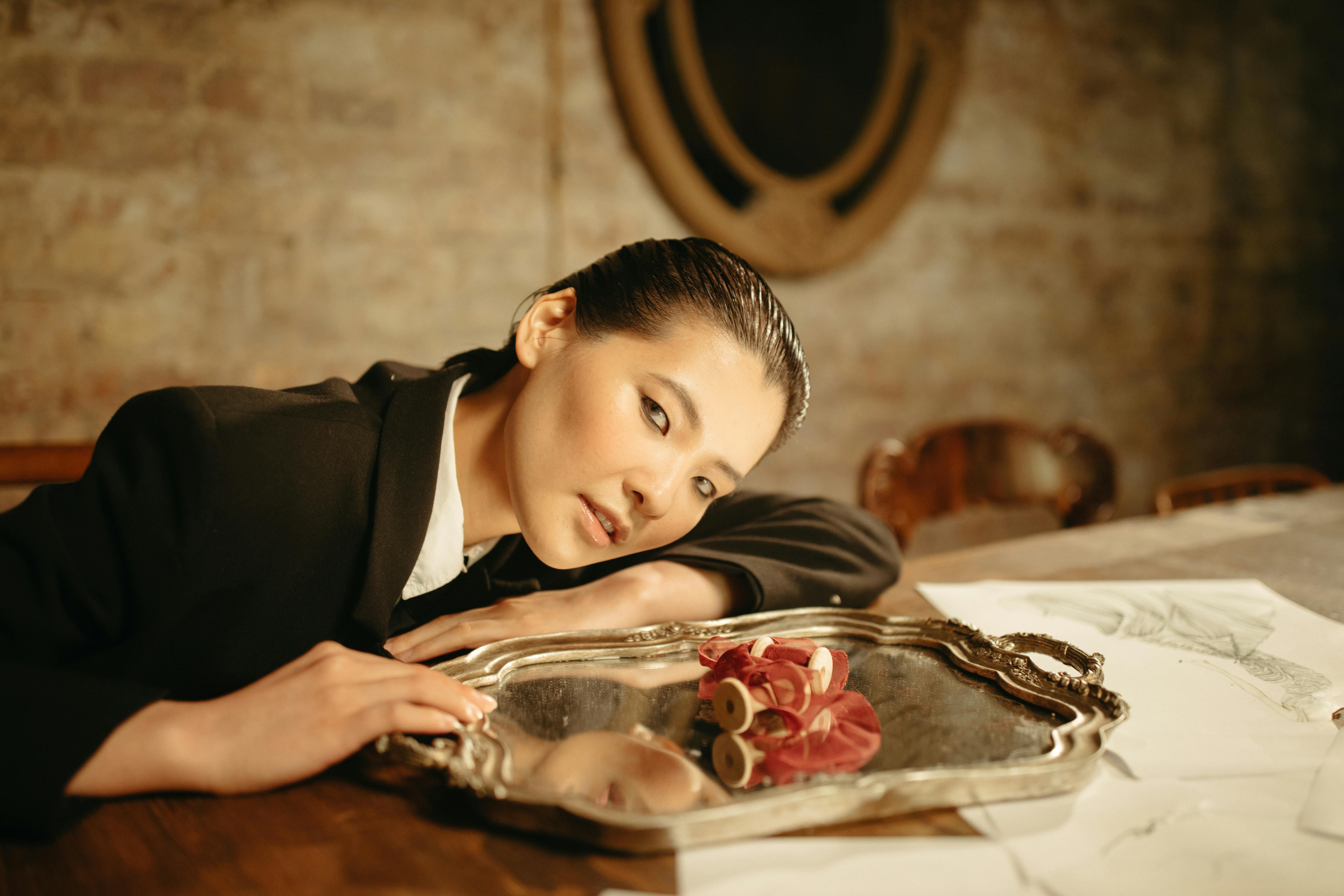 Woman Leaning on a Table · Free Stock Photo