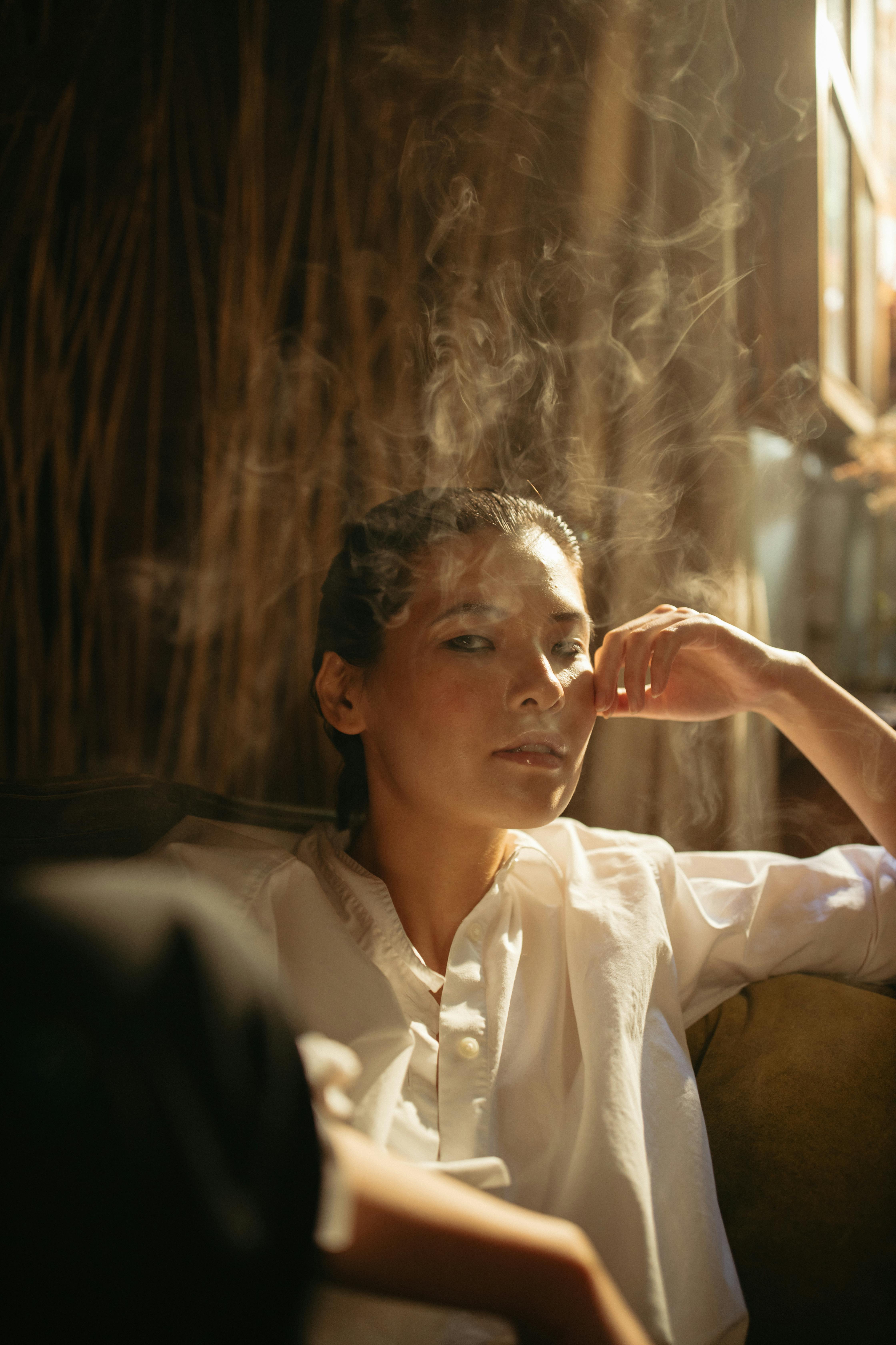 Close-Up Shot of Woman in White Shirt Smoking · Free Stock Photo