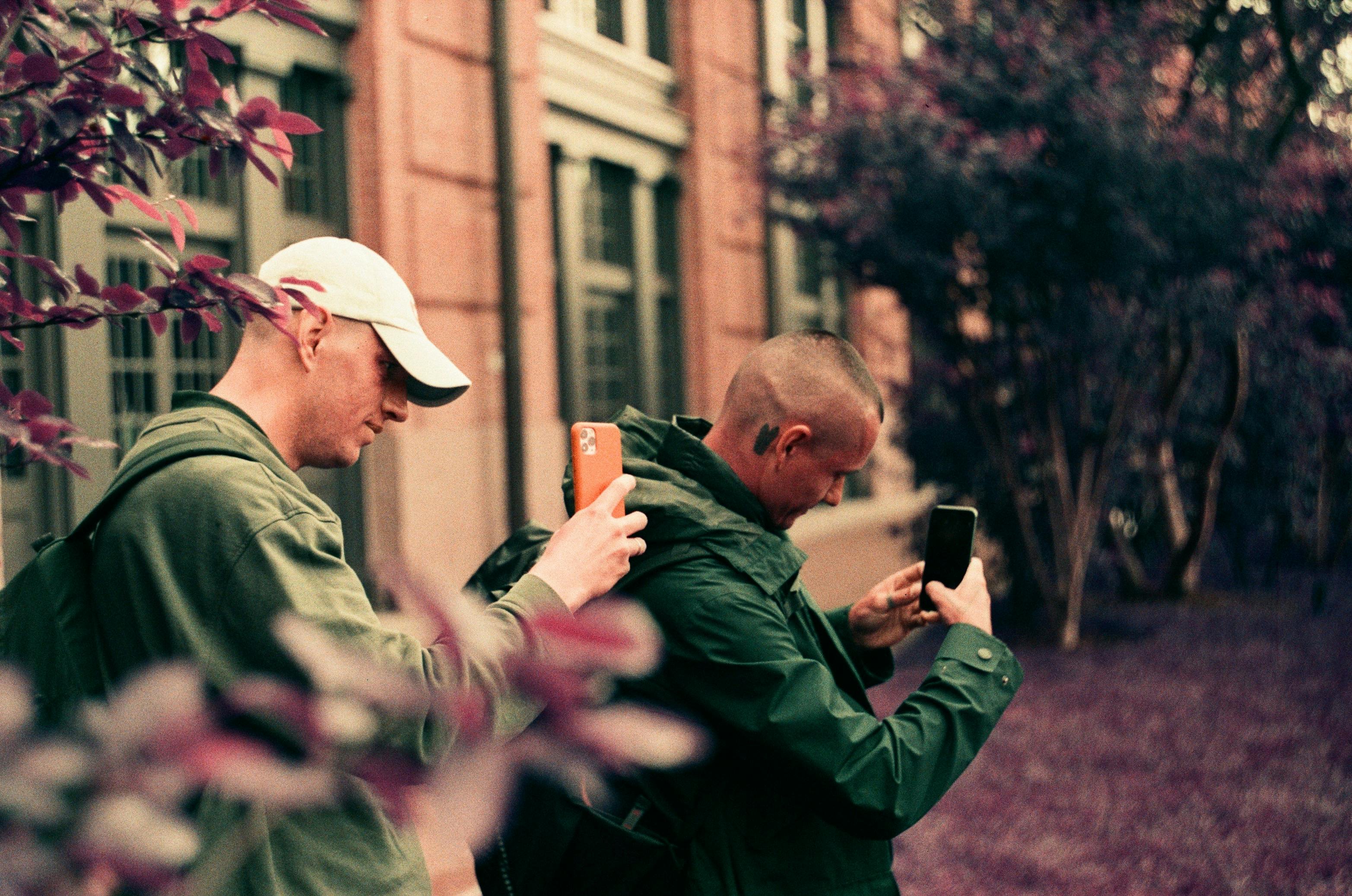 Men Photographing with Smartphones · Free Stock Photo