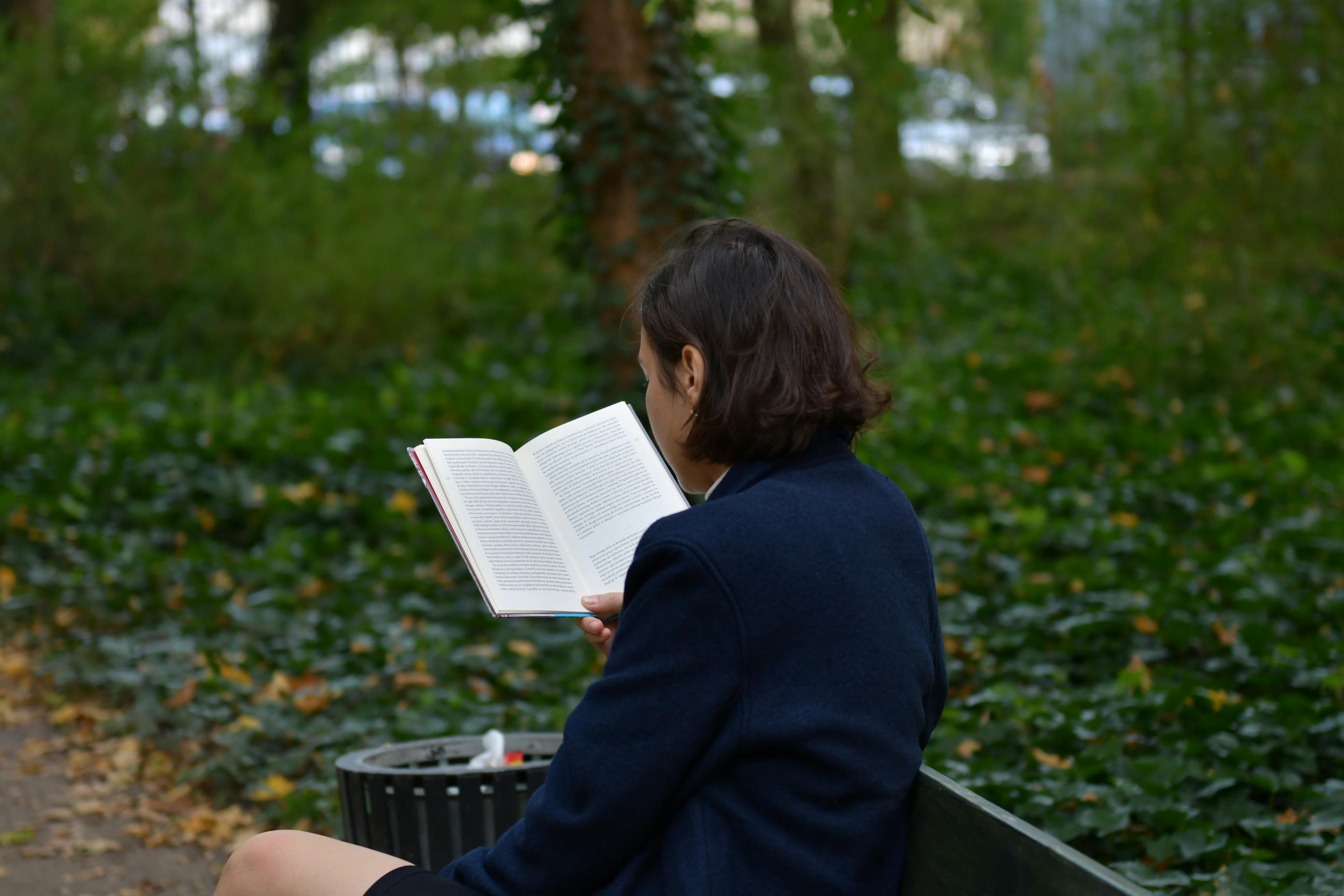 Back View of Woman Reading Book · Free Stock Photo