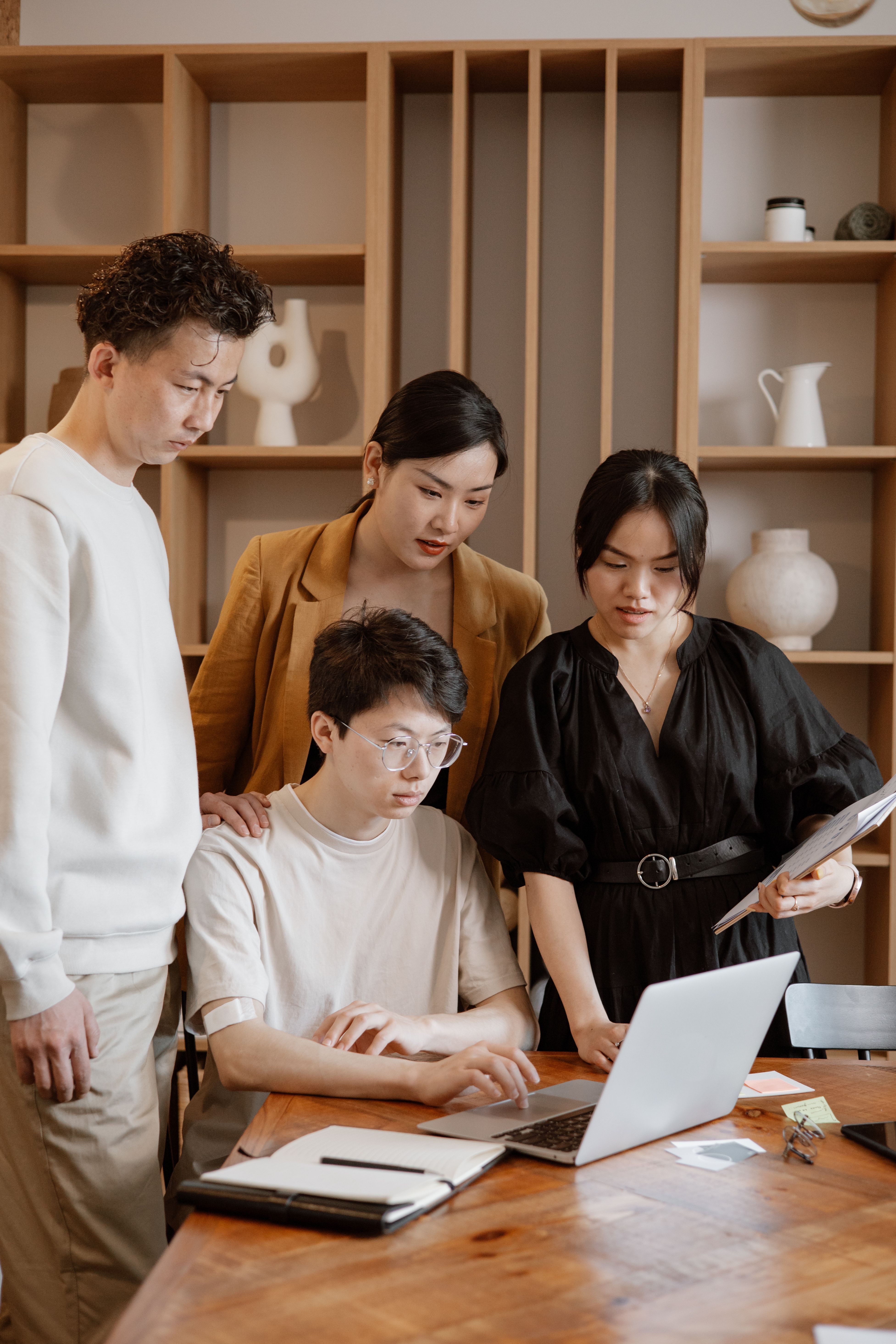 A People Looking the Laptop Together · Free Stock Photo