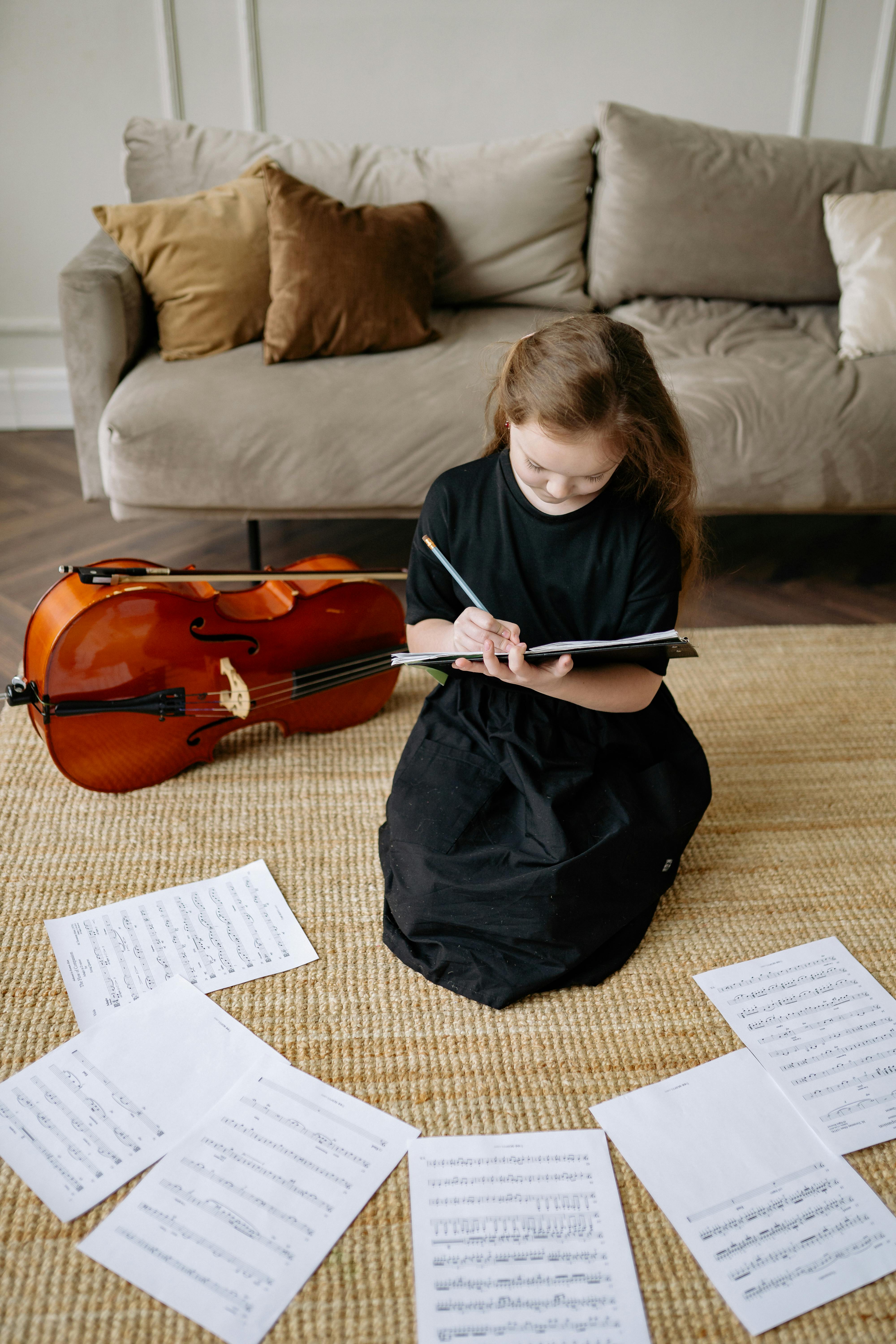 Girl Holding Green Pencil Writing Notes · Free Stock Photo