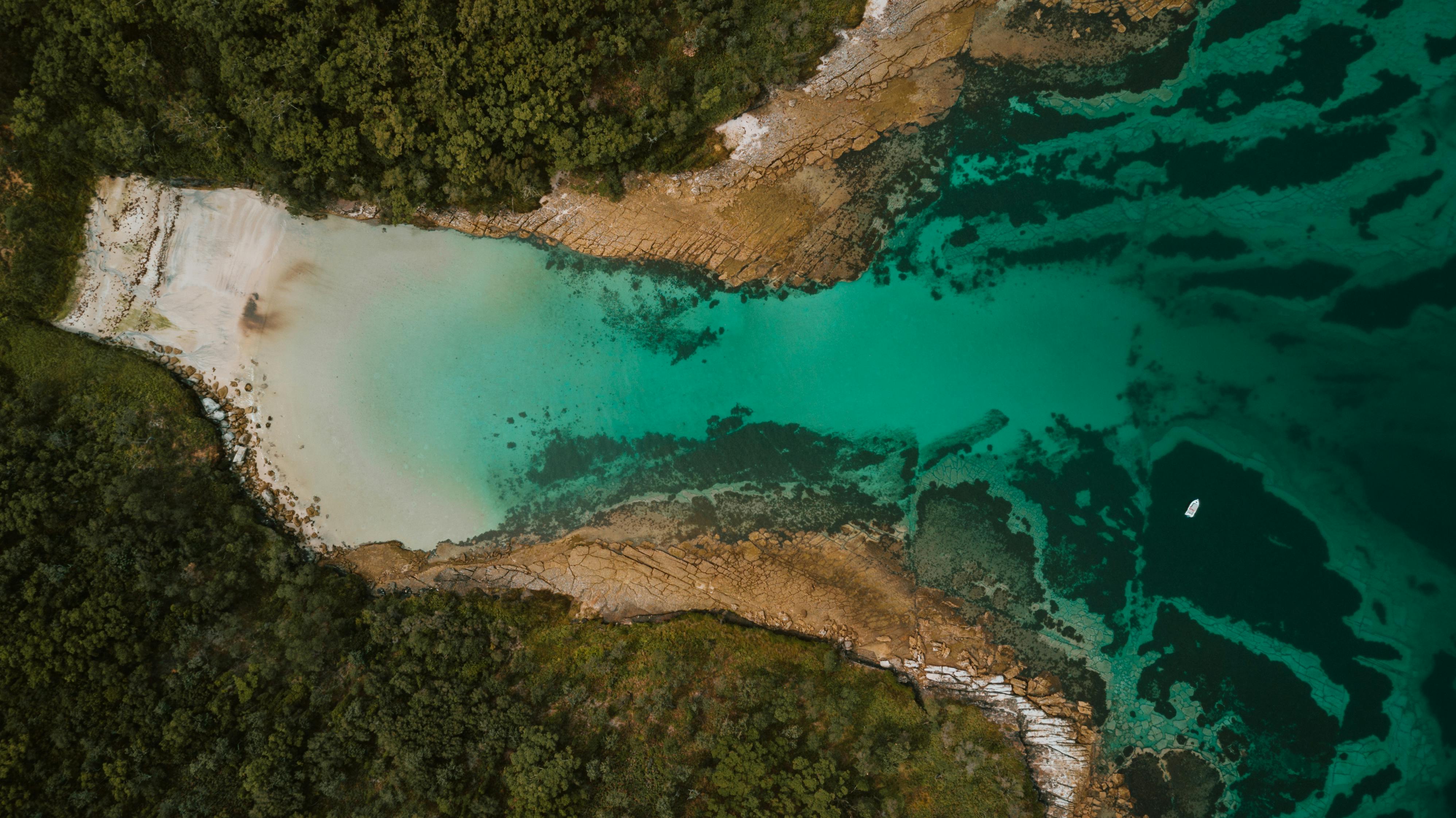 Aerial View of a Bay with Turquoise Water · Free Stock Photo